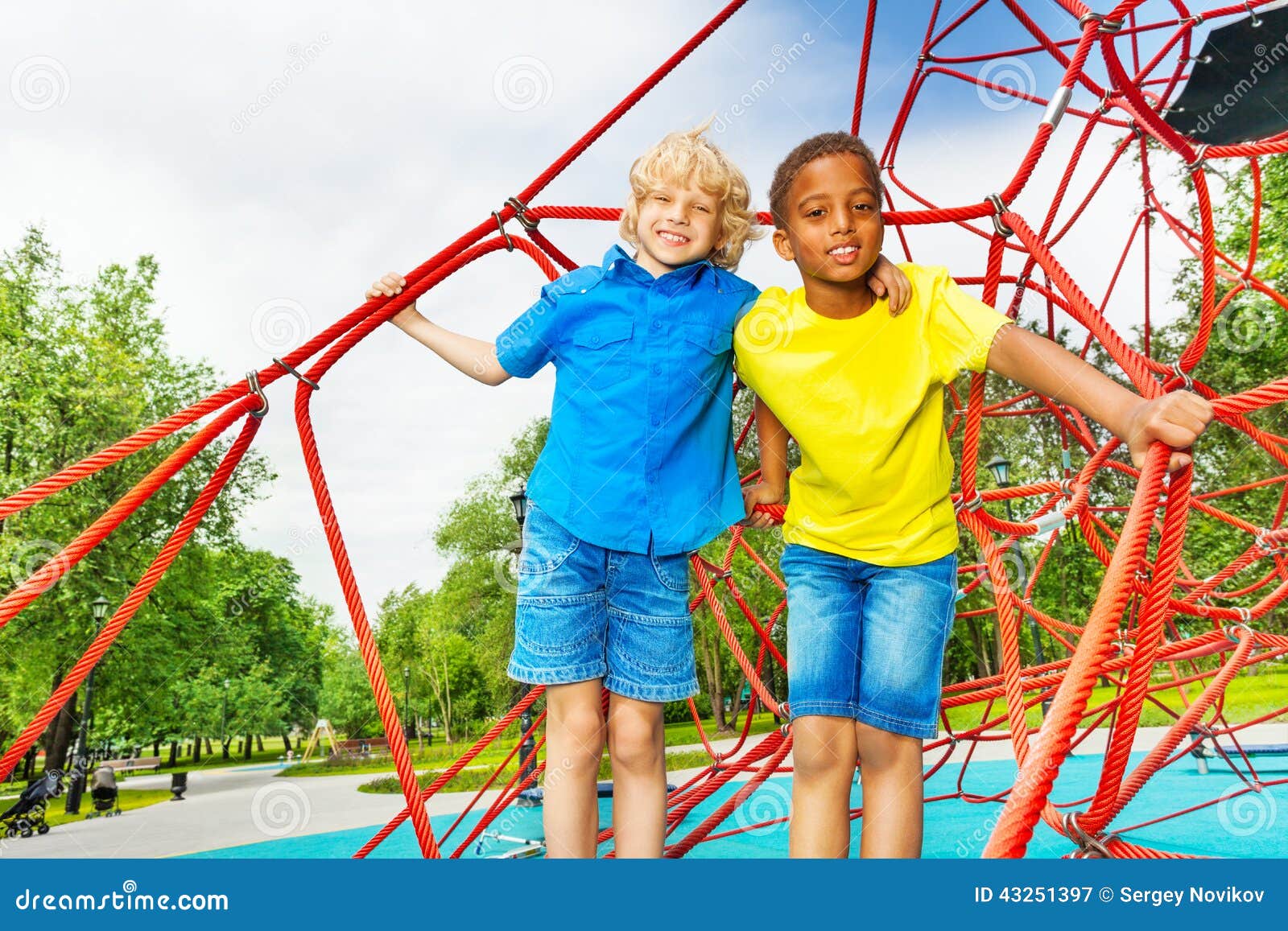 Two Diverse Looking Boys Stand Close on Red Web Stock Image - Image of ...