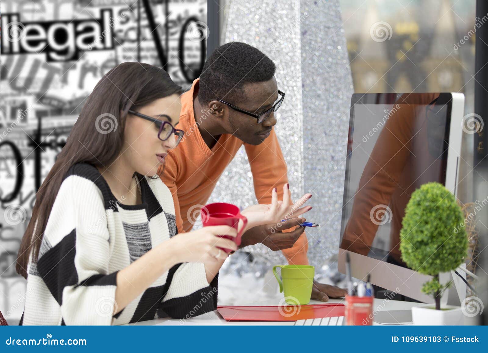Two Diverse Work Colleagues Smiling and Writing Down Notes while ...