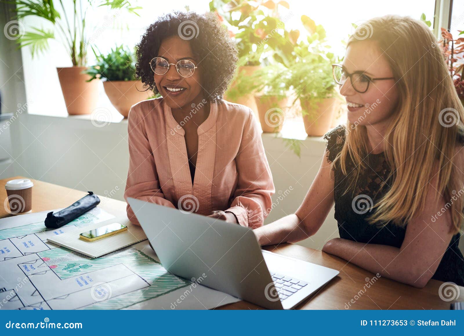 Smiling Designers Working Together at a Boardroom Table Stock Image ... Smiling Designers Working Together at a Boardroom Table Stock Image ...