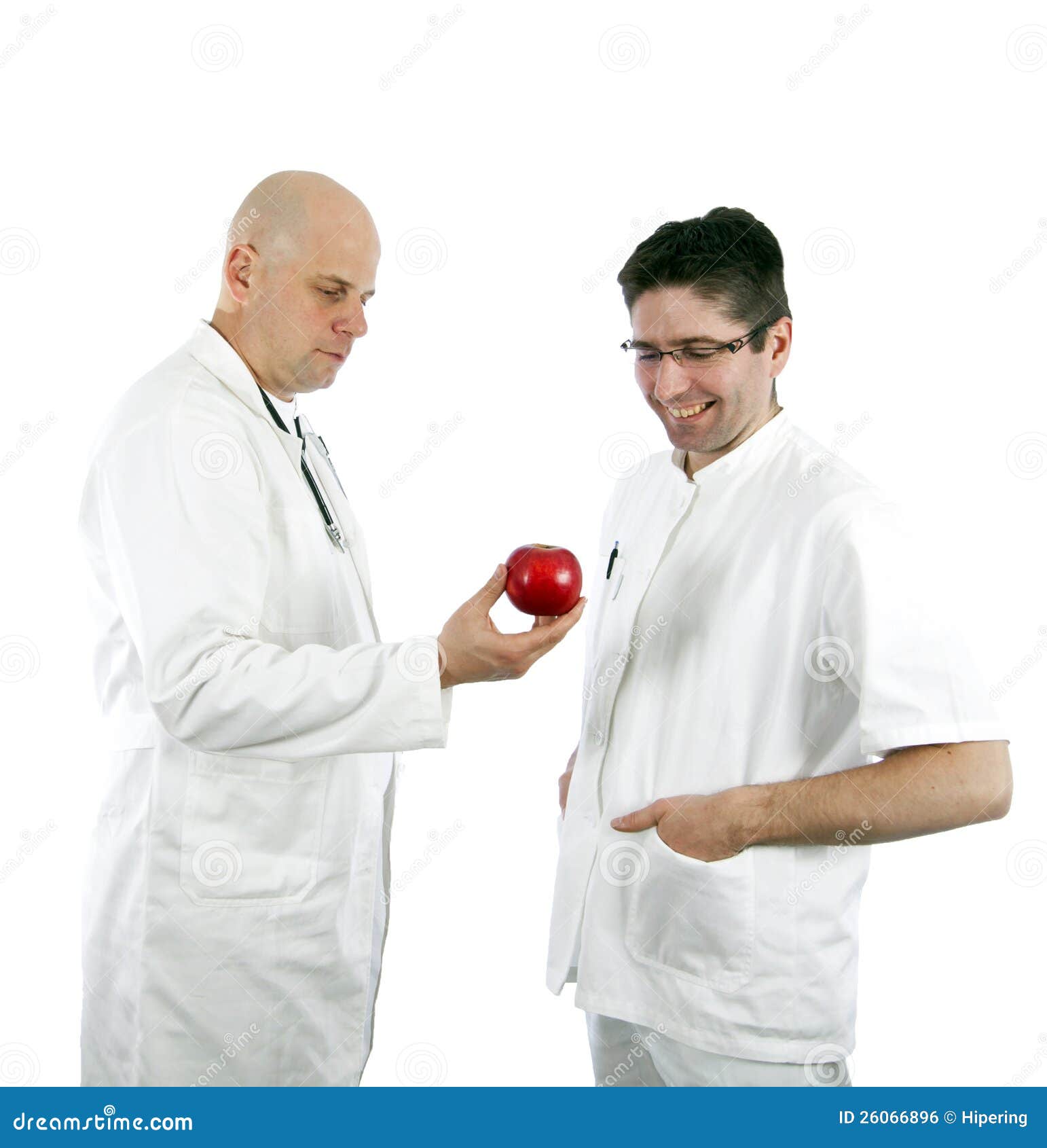 Two doctors and an apple stock photo. Image of testing - 26066896