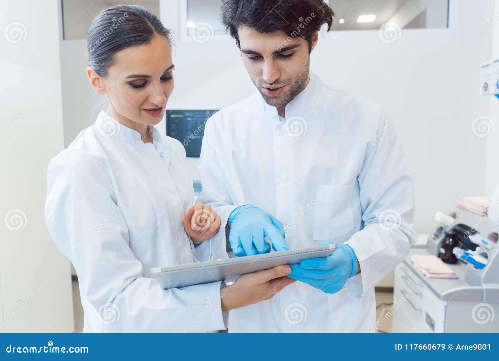 Two Doctors As Team Looking at Tablet Computer Data Stock Image - Image ...