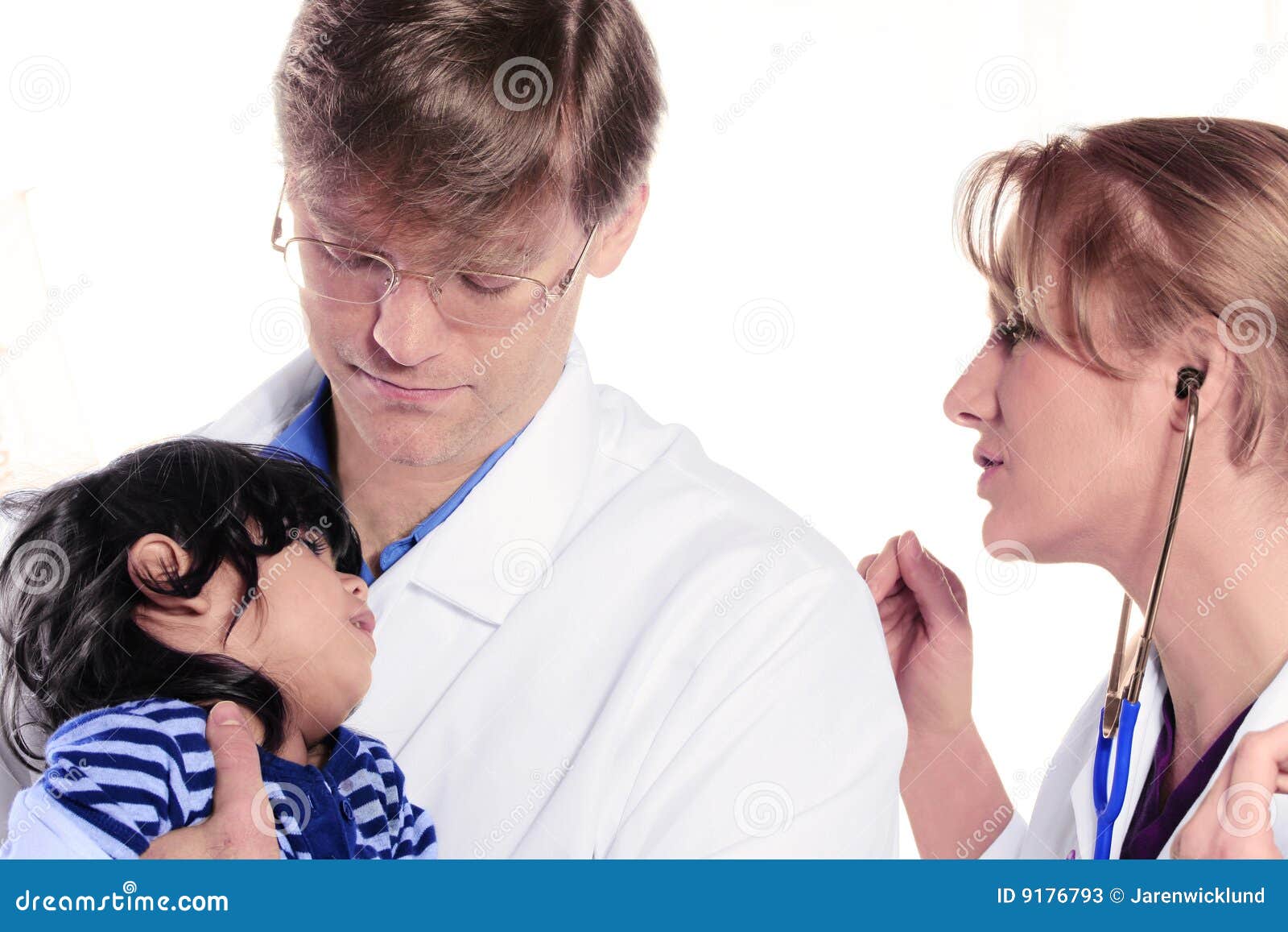 Two Doctors Caring for Scared Child Patient Stock Image - Image of ...