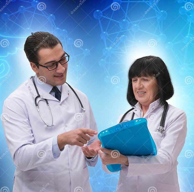 Two Doctors Discussing Issues in Telemedicine Concept Stock Image ...