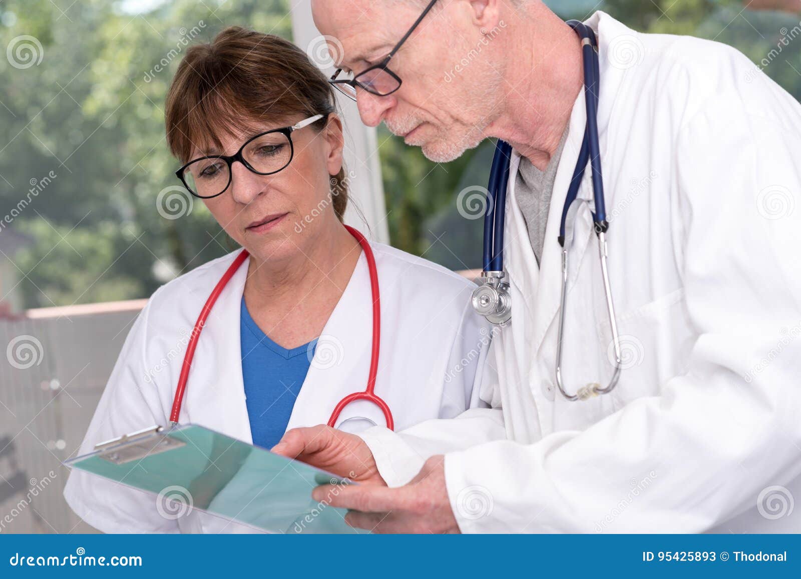 Two Doctors Discussing about Medical Report Stock Image - Image of ...