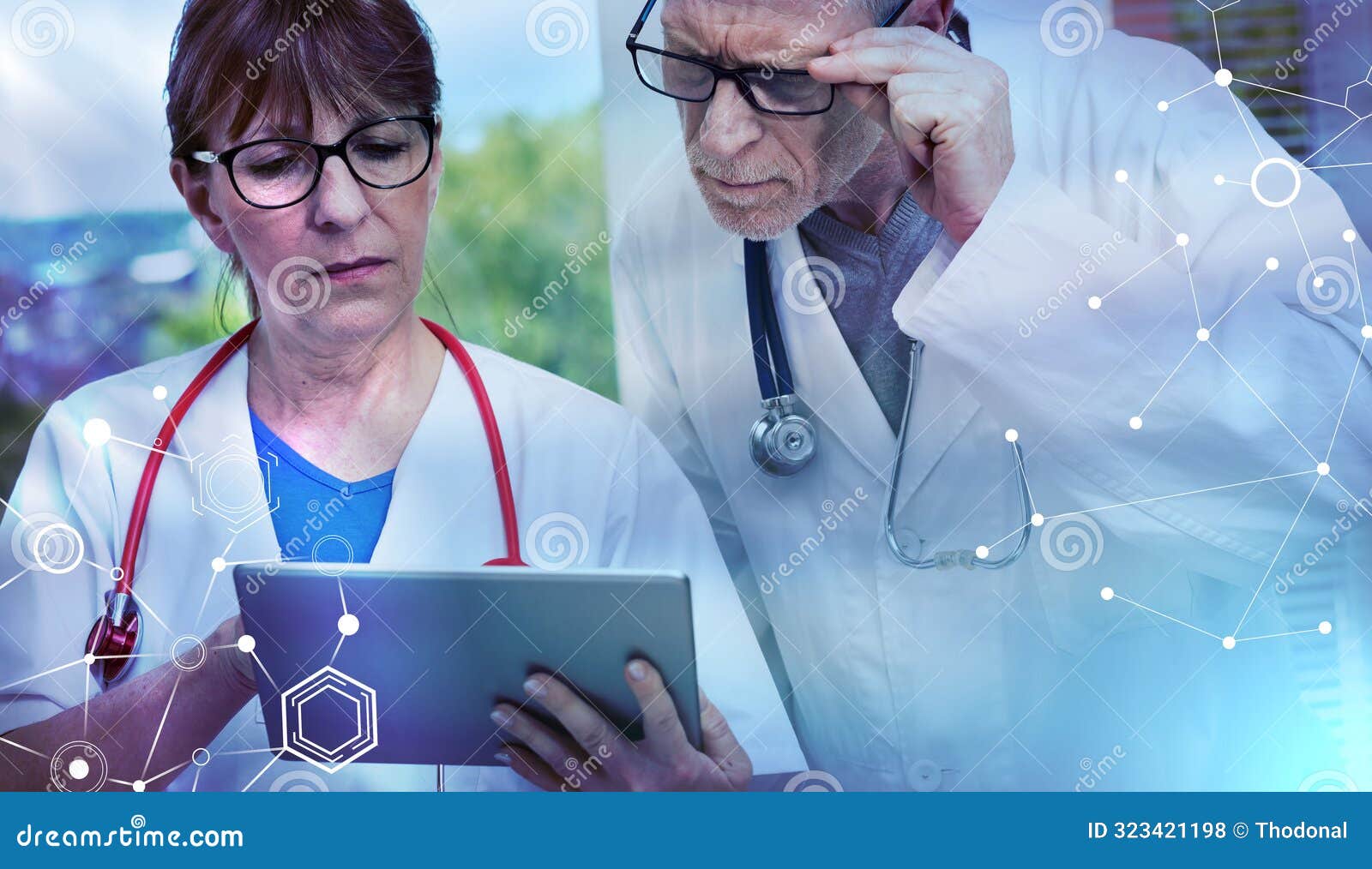 Two Doctors Discussing about Medical Report on Tablet Light Effect ...