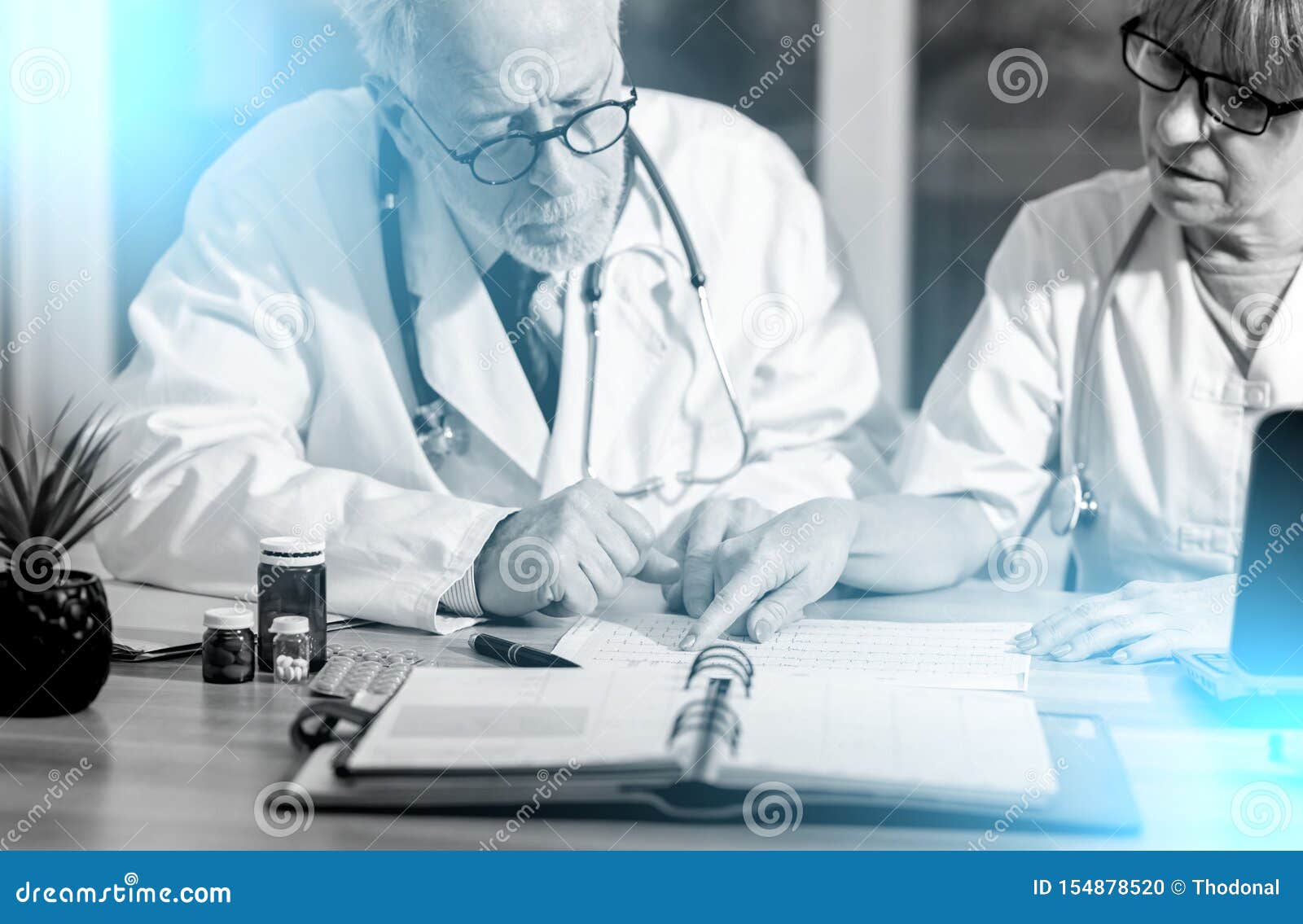 Two Doctors Discussing about Medical Results; Light Effect Stock Photo ...