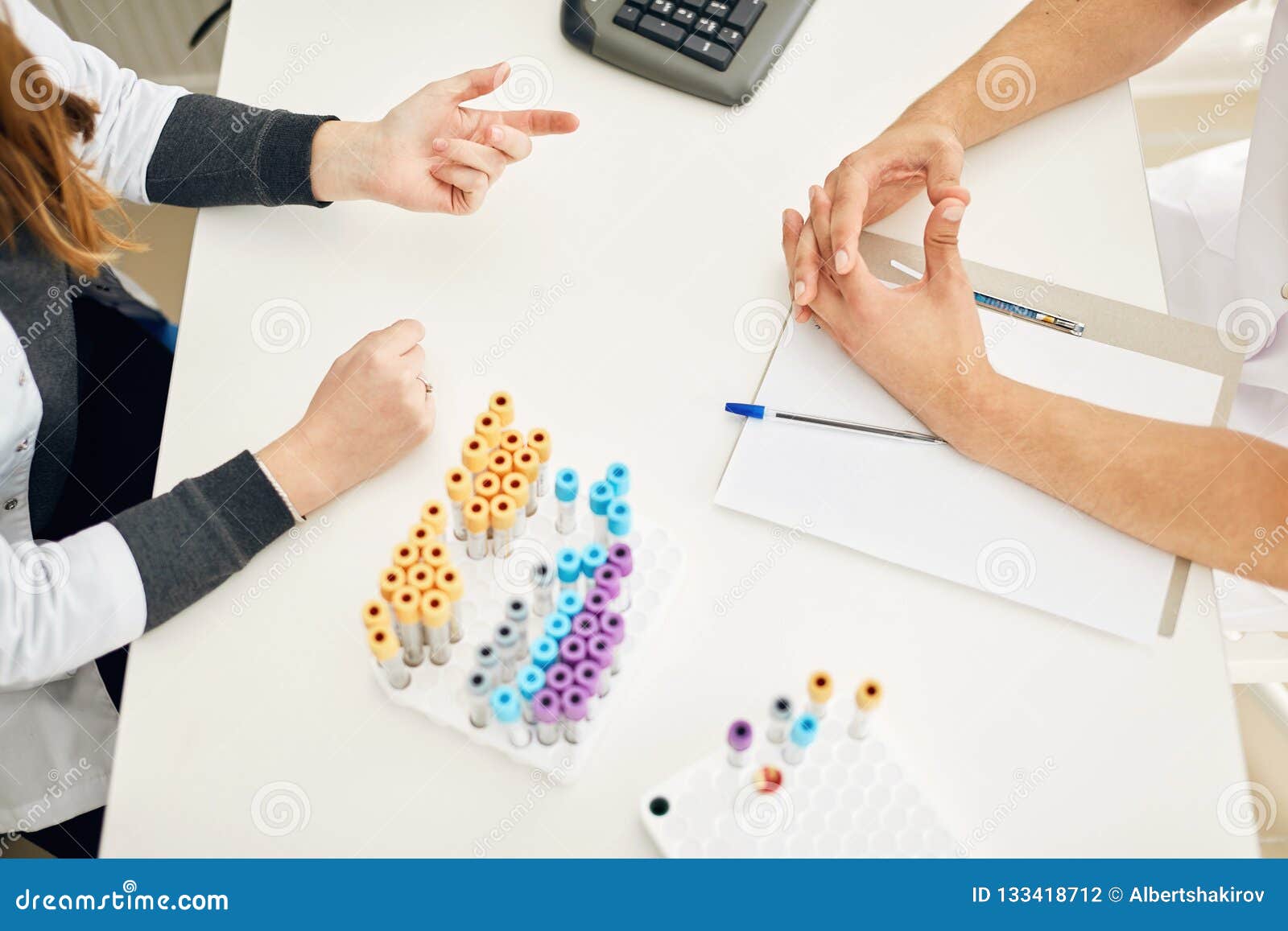 Two Doctors Discussing Problems at Workplace Stock Photo - Image of ...