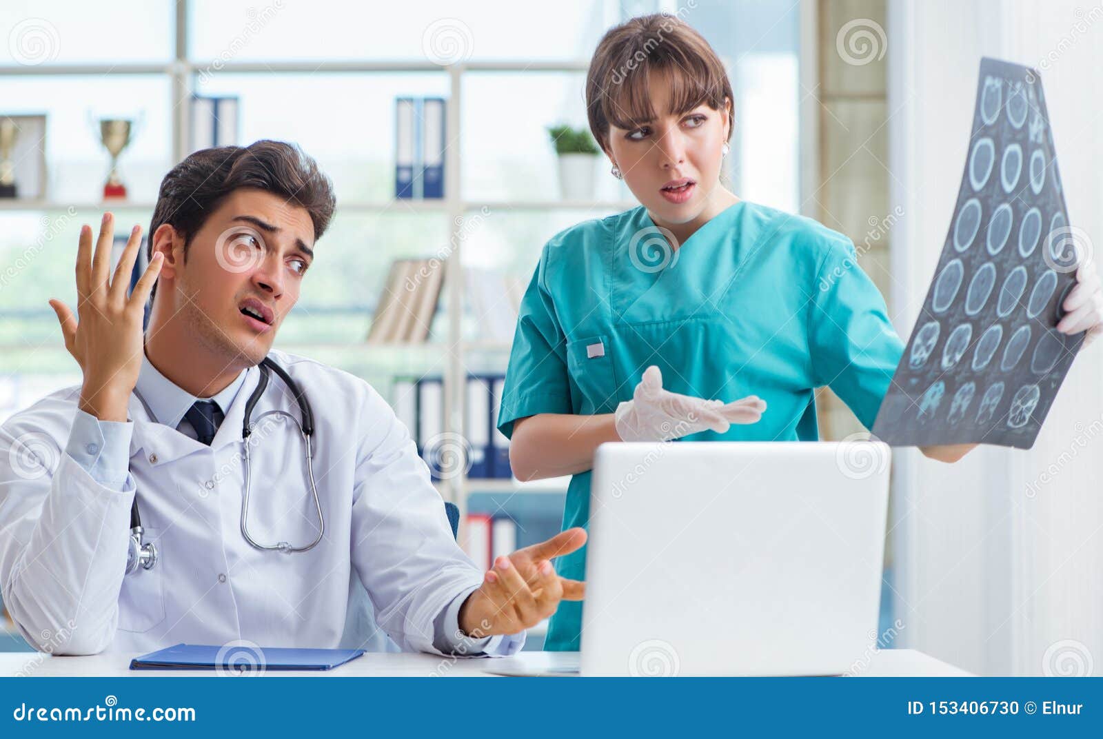 Two Doctors Discussing X-ray MRI Image in Hospital Stock Photo - Image ...