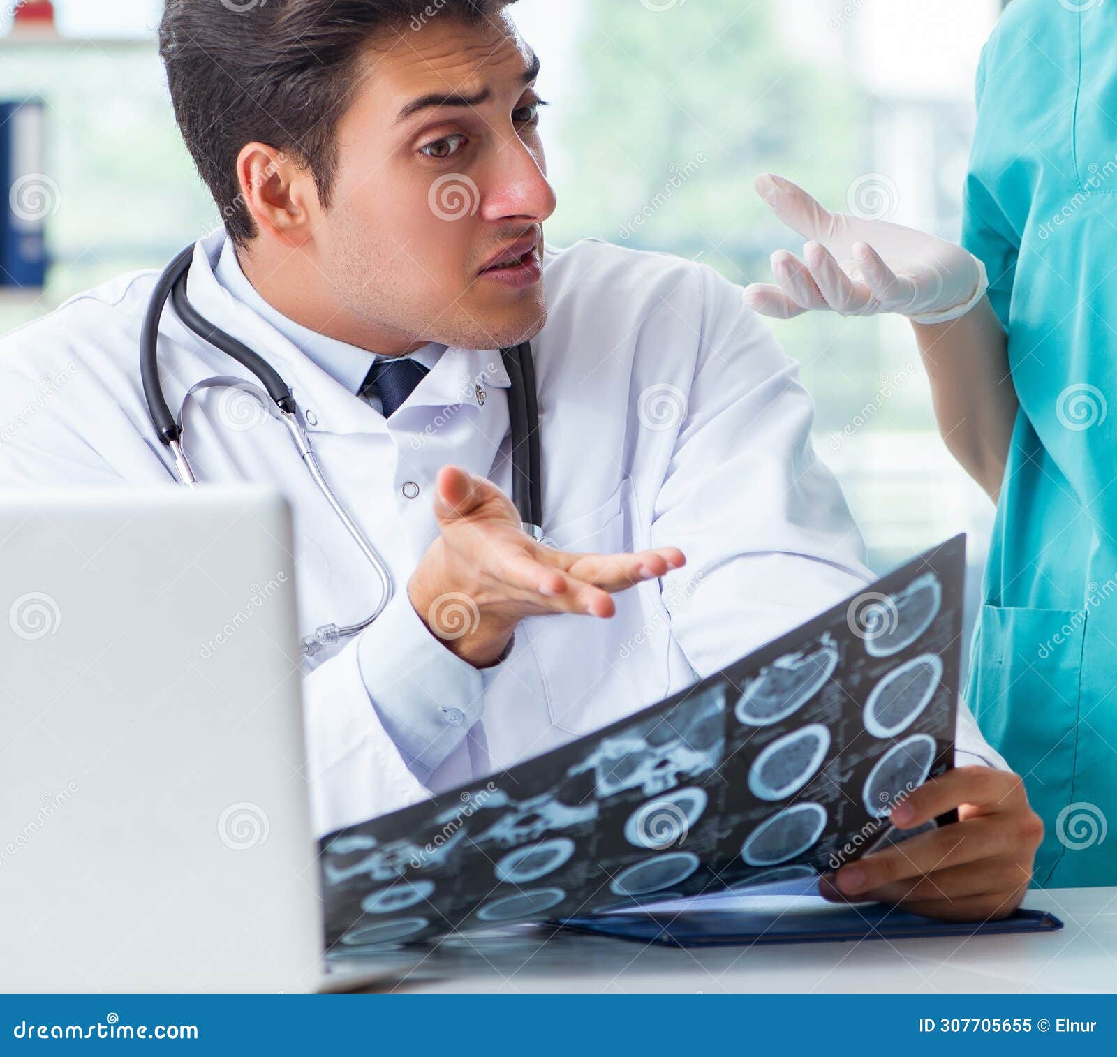 Two Doctors Discussing X-ray MRI Image in Hospital Stock Image - Image ...