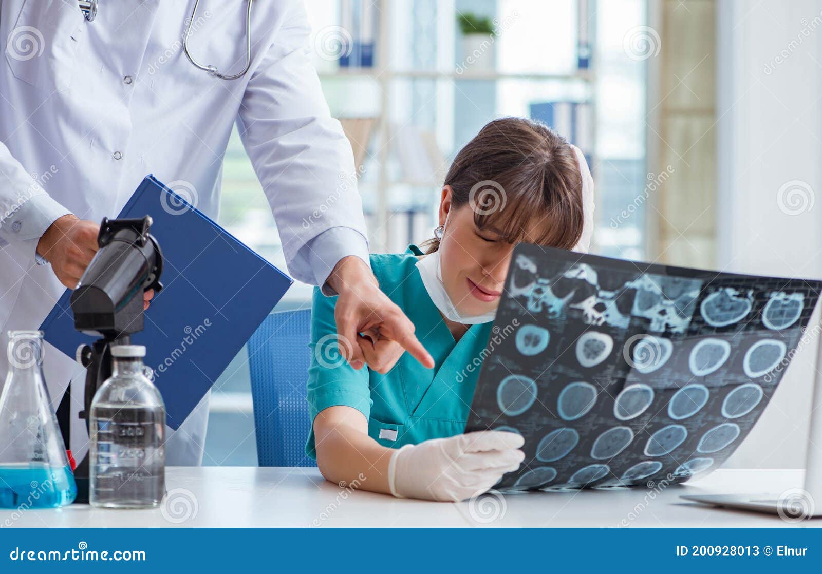 Two Doctors Discussing X-ray MRI Image in Hospital Stock Image - Image ... Two Doctors Discussing X-ray MRI Image in Hospital Stock Image - Image ...