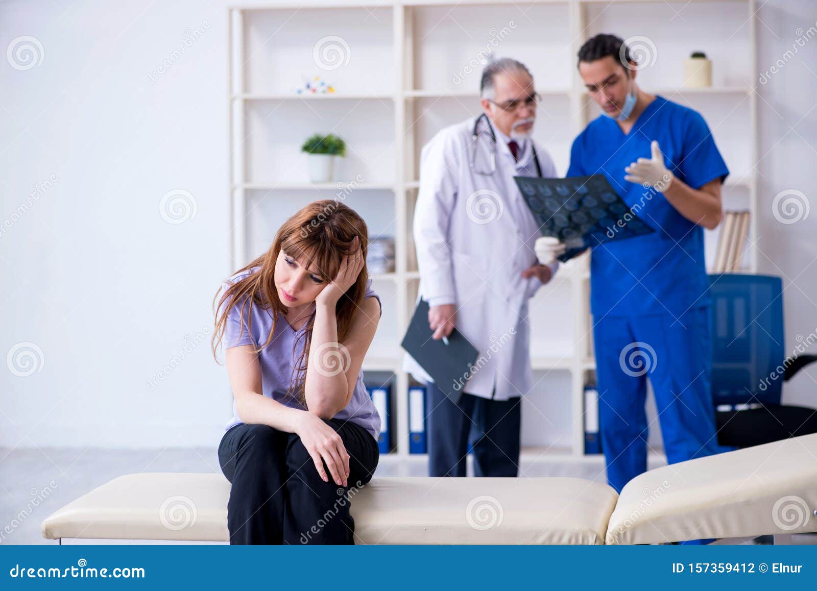 Two Doctors Examining Young Woman Stock Photo - Image of migraine ...
