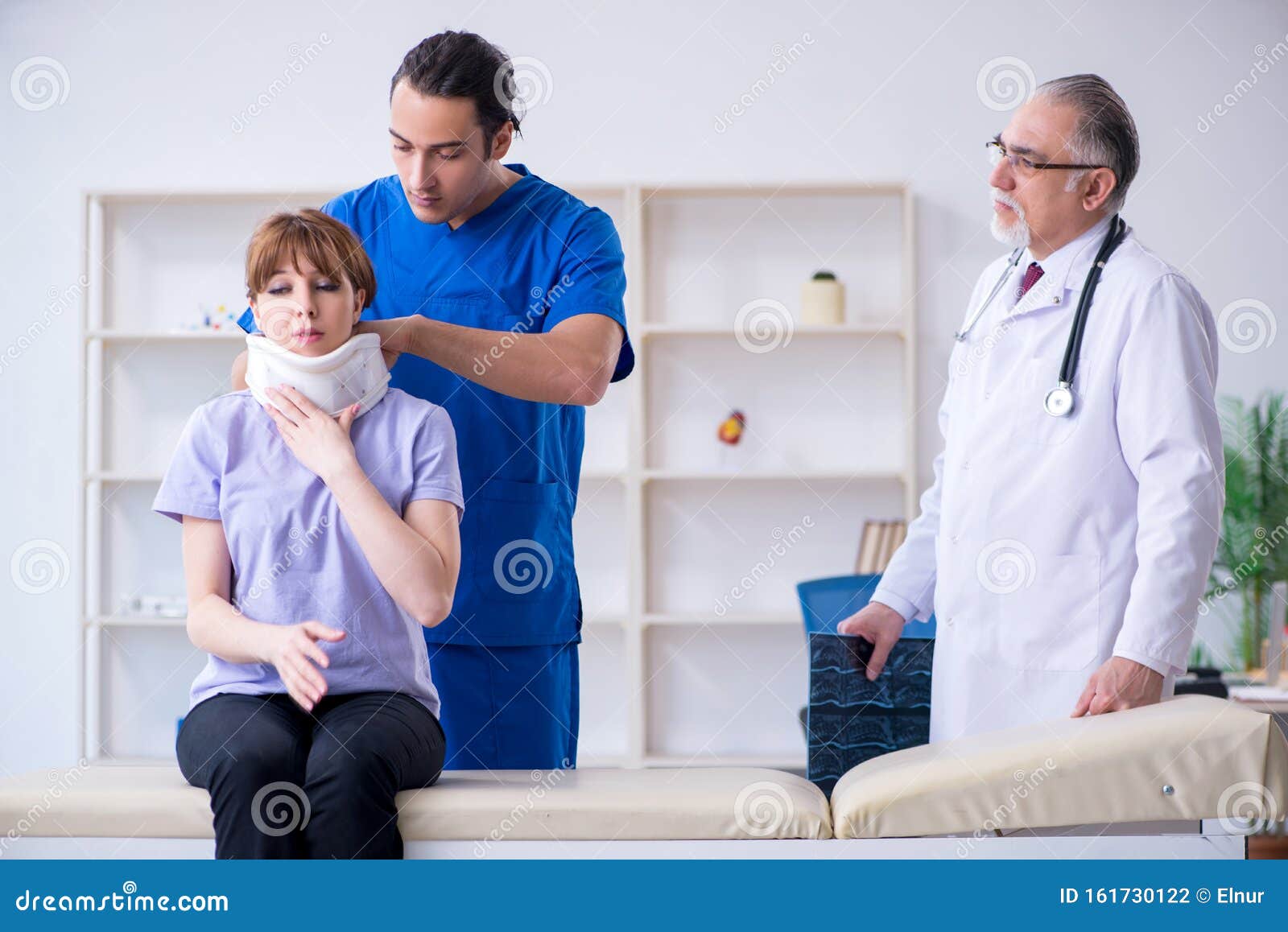 Two Doctors Examining Young Woman Stock Photo - Image of diagnostic ...