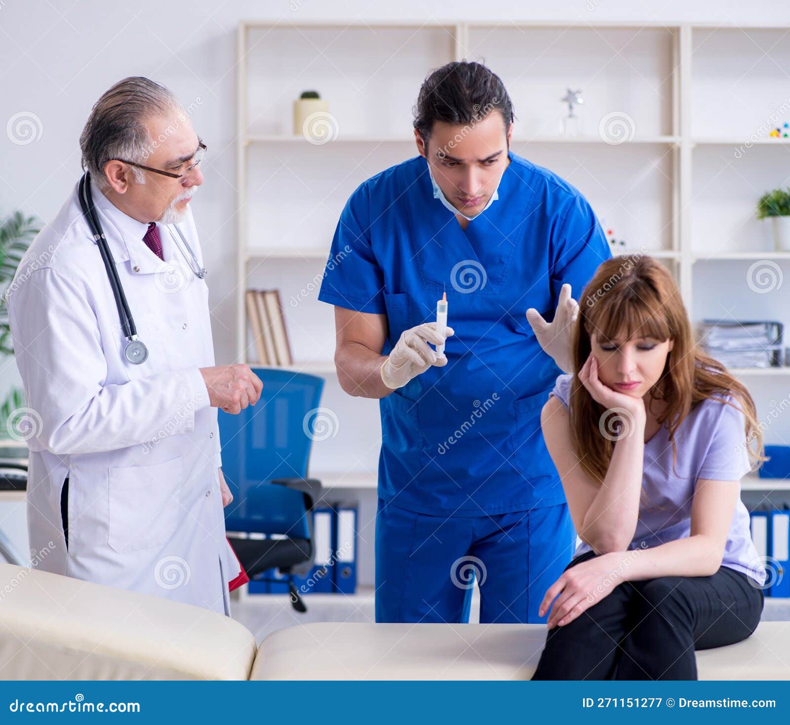 Two Doctors Examining Young Woman Stock Image - Image of insurance ...