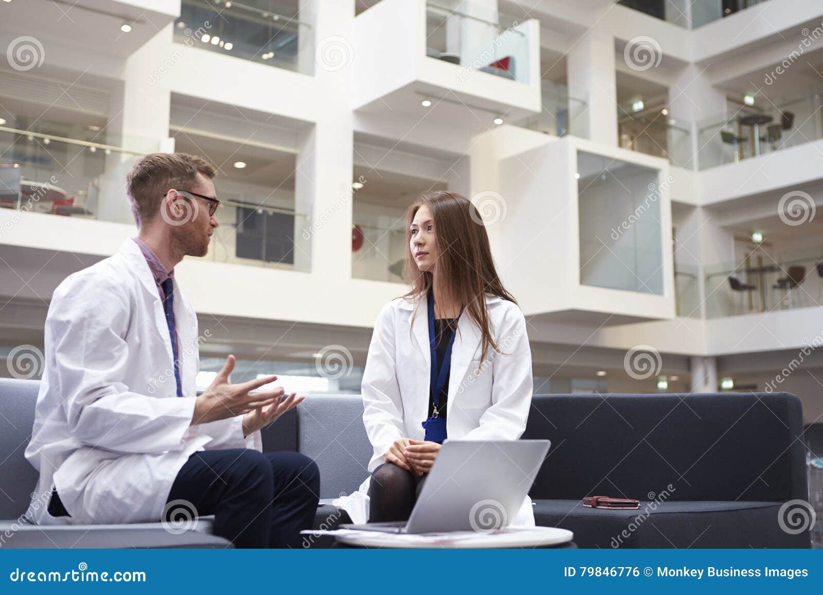 Two Doctors Having Meeting in Hospital Reception Area Stock Photo ...