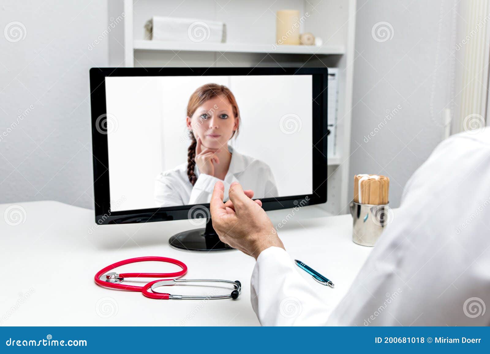 Two Doctors are Having a Videoconference in a Office Stock Photo ...