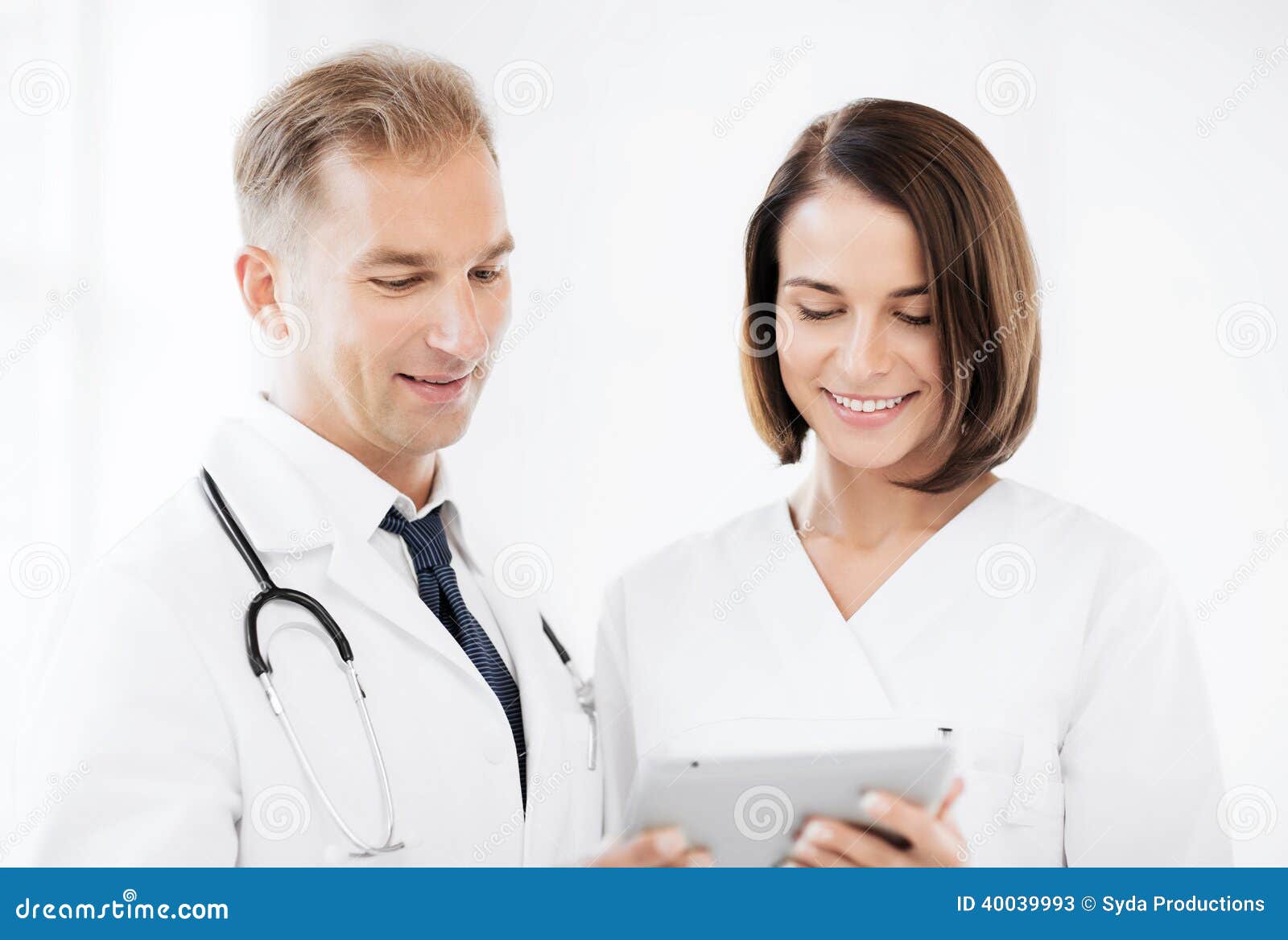 Two Doctors Looking at Tablet Pc Stock Image - Image of medics ...