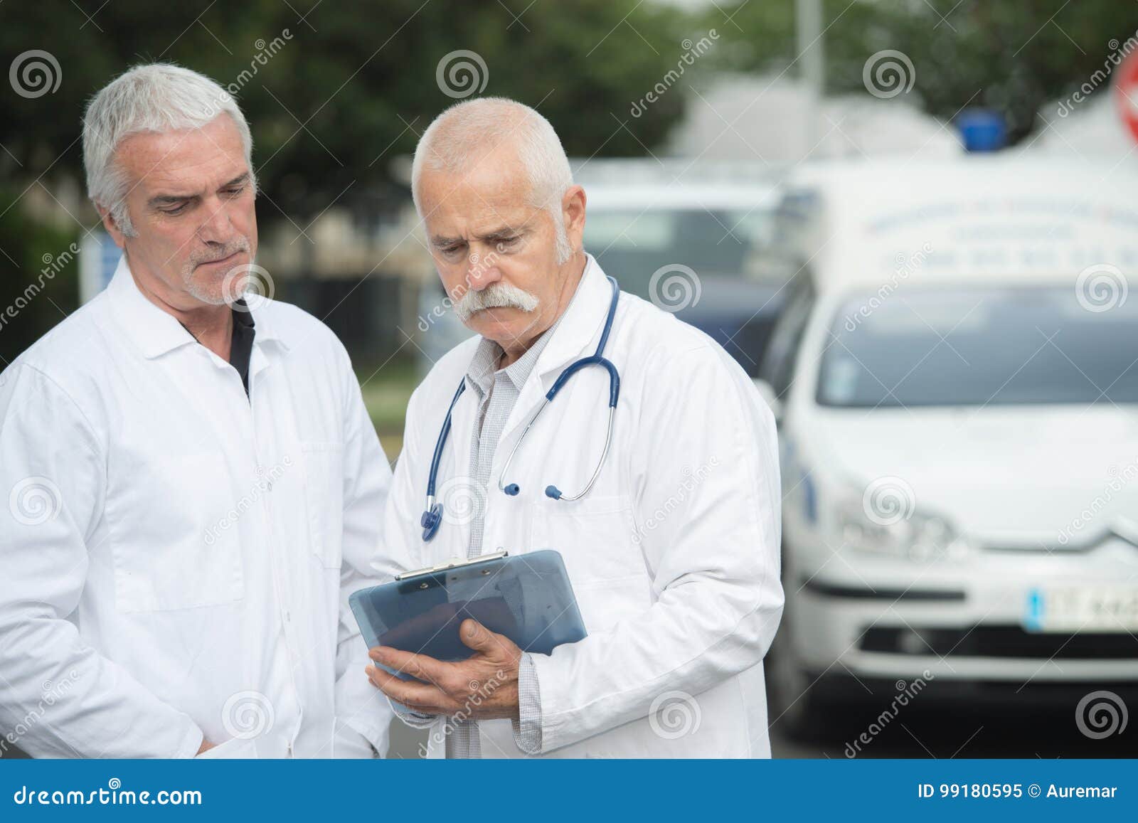 Two Doctors Outside in Front Ambulance Stock Image - Image of skilled ...