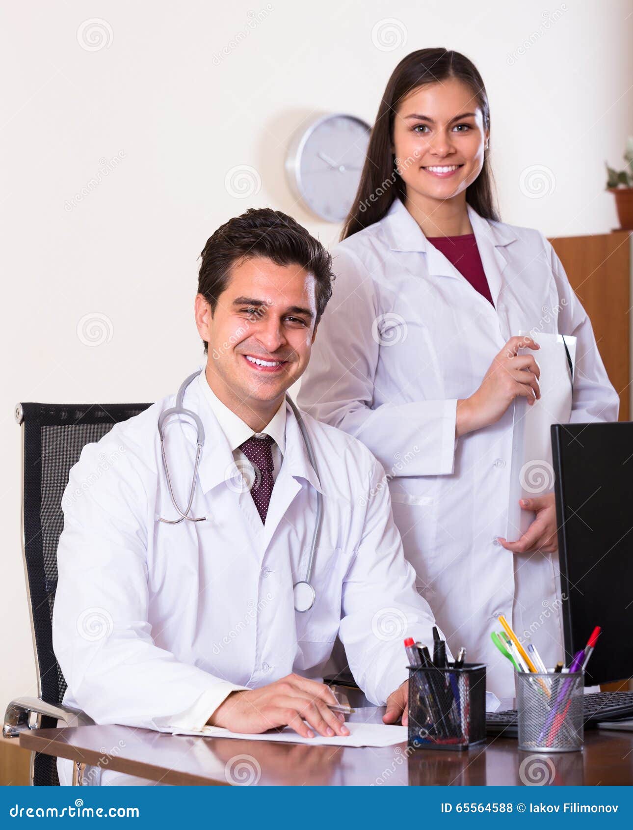 Two Doctors in Private Clinic Stock Photo - Image of desk, paramedics ...