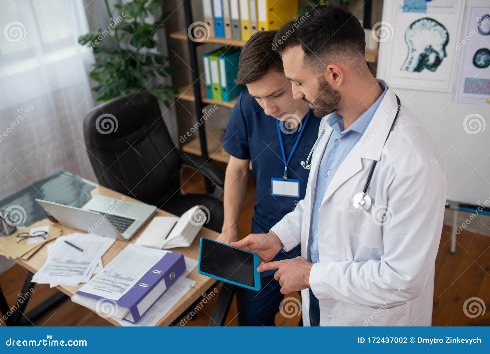 Two Doctors Searching for Information on a Tablet Stock Photo - Image ...