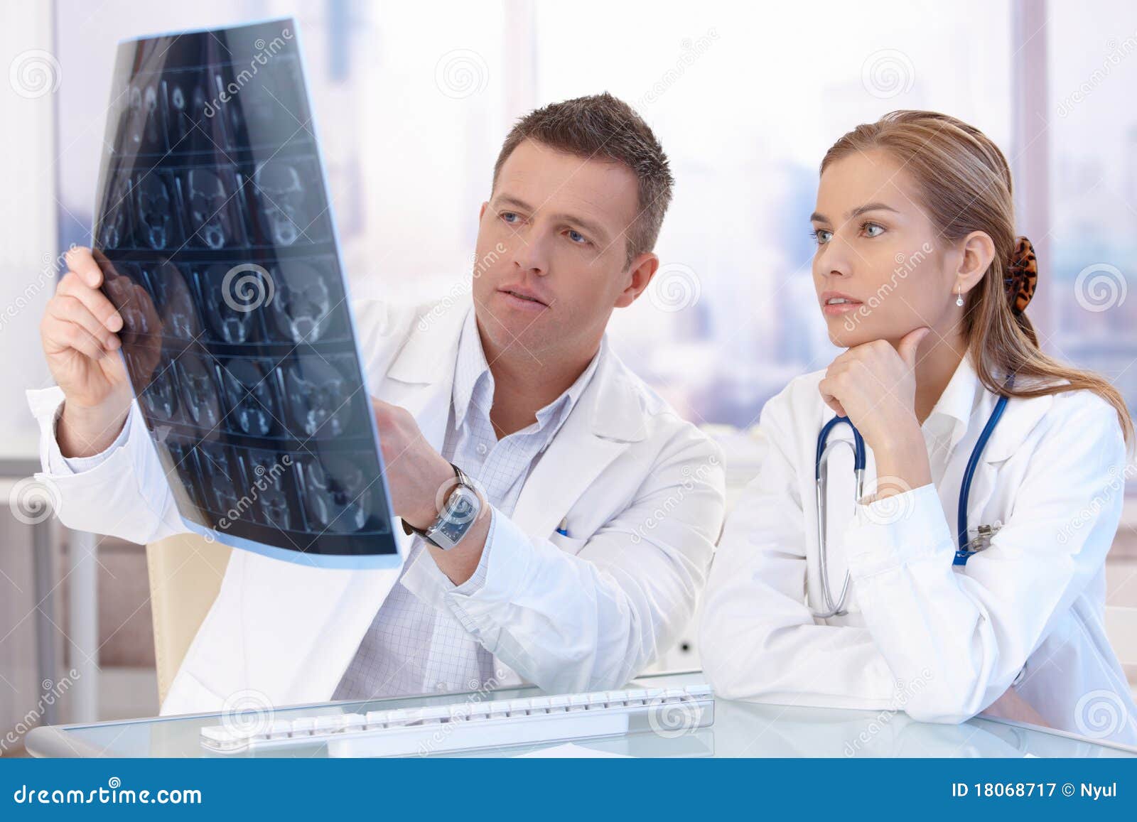 Two Doctors Studying X-ray Image Consulting Stock Image - Image of face ...