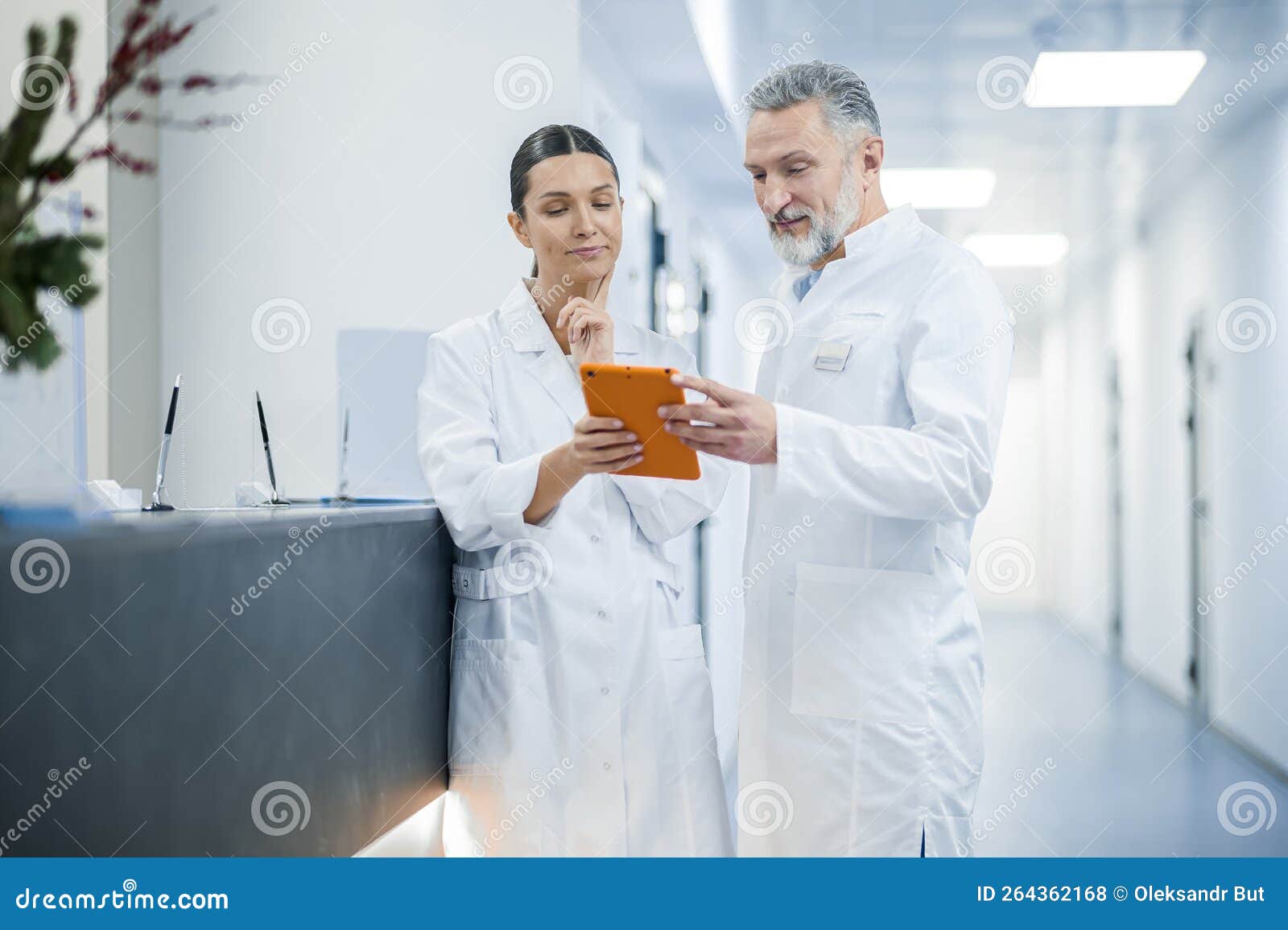 Two Doctors Talking in the Hospital during the Shift Change Stock Photo ...