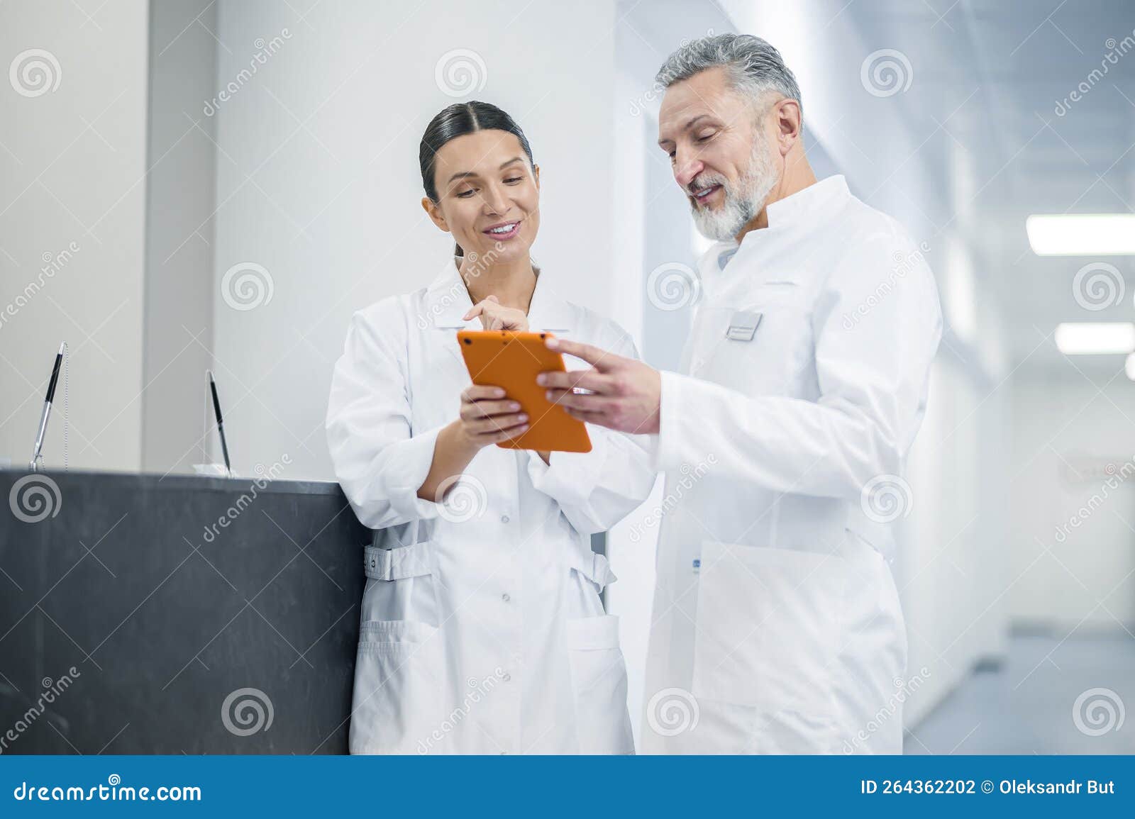 Two Doctors Talking in the Hospital during the Shift Change Stock Photo ...