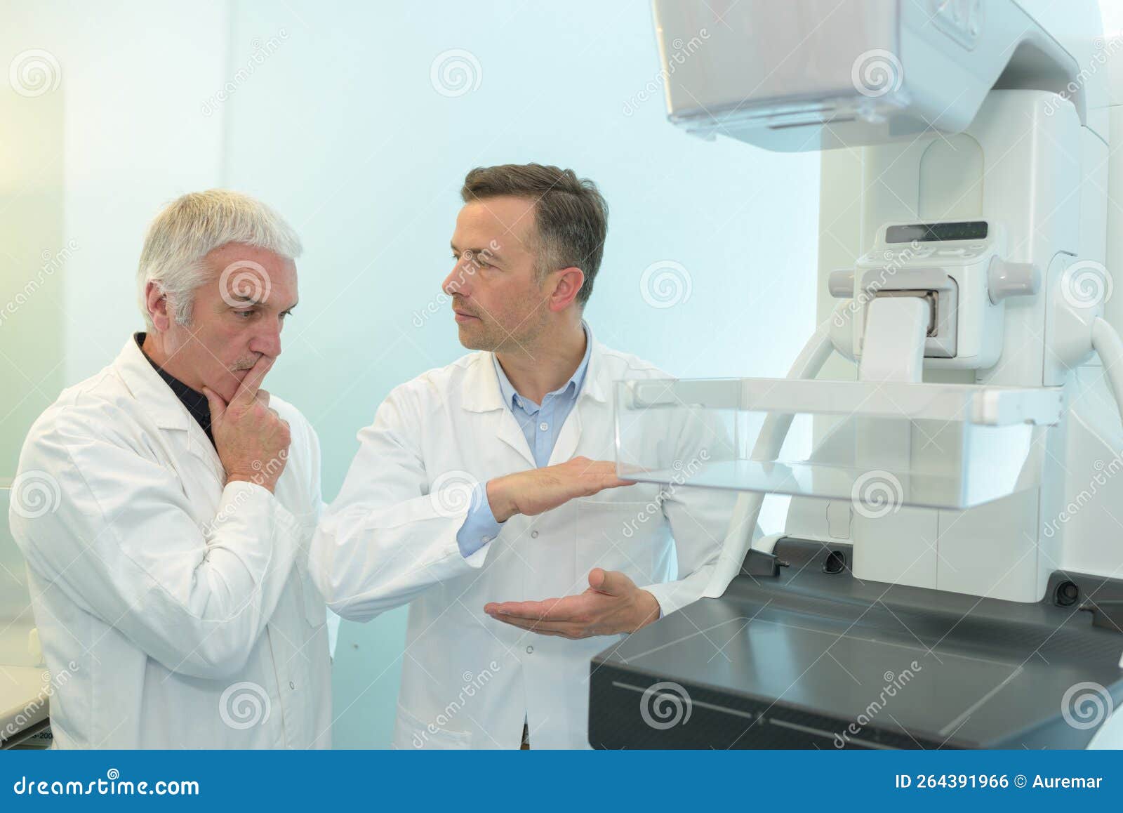 Two Doctors Talking Near Machine Stock Photo - Image of machine, people ...