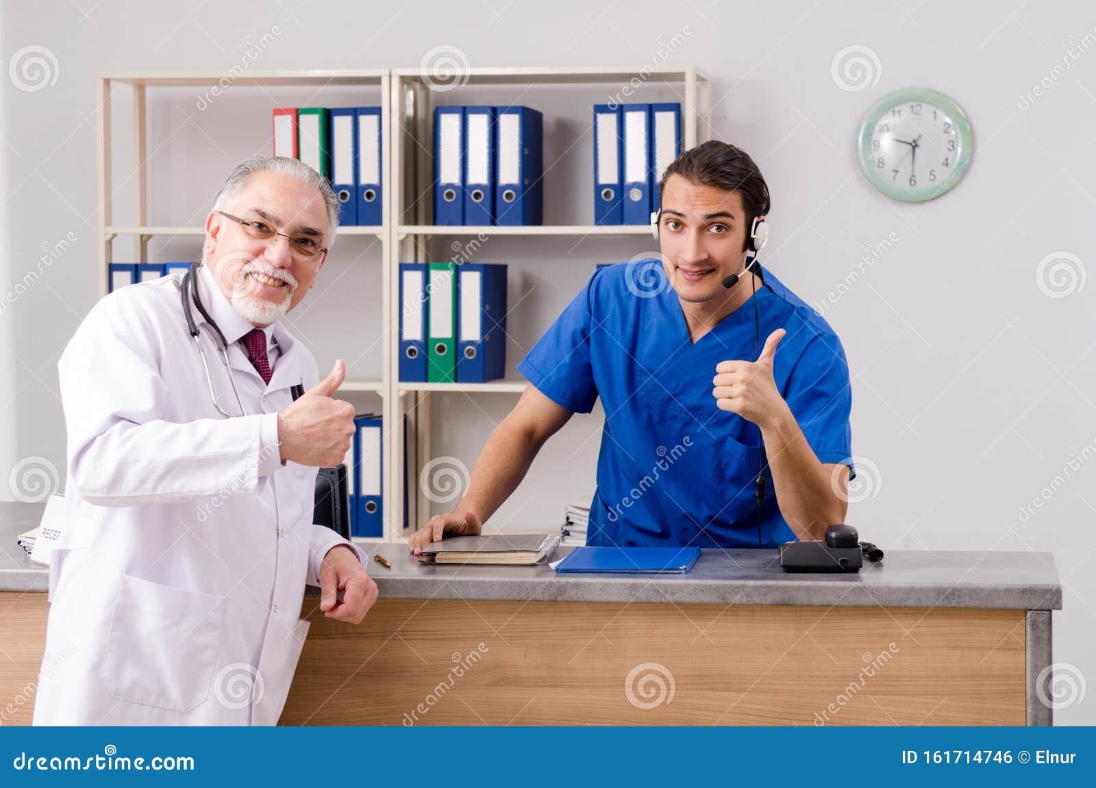 Two Doctors Talking at the Reception in Hospital Stock Photo - Image of ...