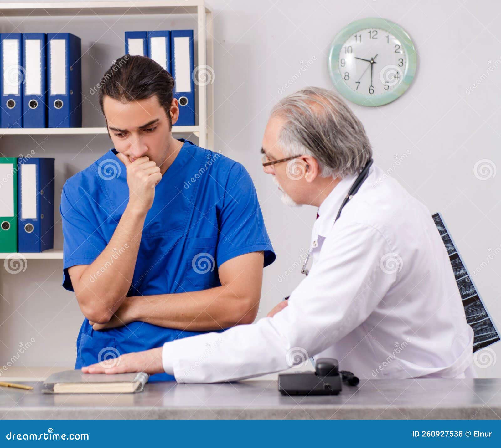 Two Doctors Talking at the Reception in Hospital Stock Photo - Image of ...