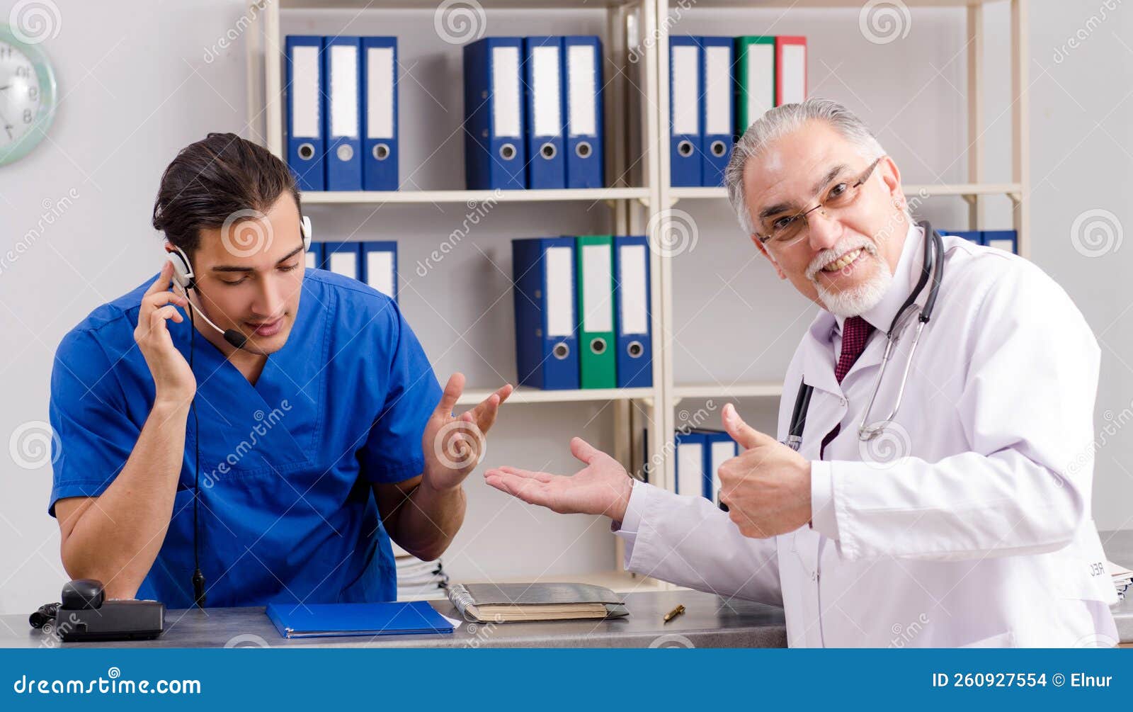 Two Doctors Talking at the Reception in Hospital Stock Photo - Image of ...