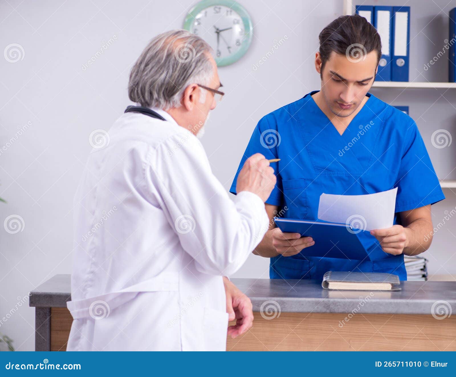 Two Doctors Talking at the Reception in Hospital Stock Photo - Image of ...