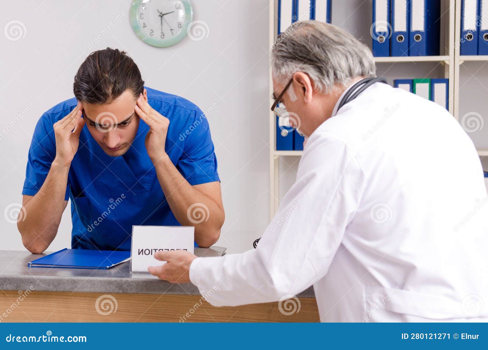 Two Doctors Talking at the Reception in Hospital Stock Image - Image of ...