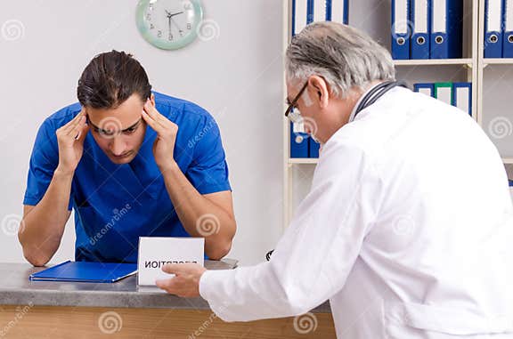 Two Doctors Talking at the Reception in Hospital Stock Image - Image of ...