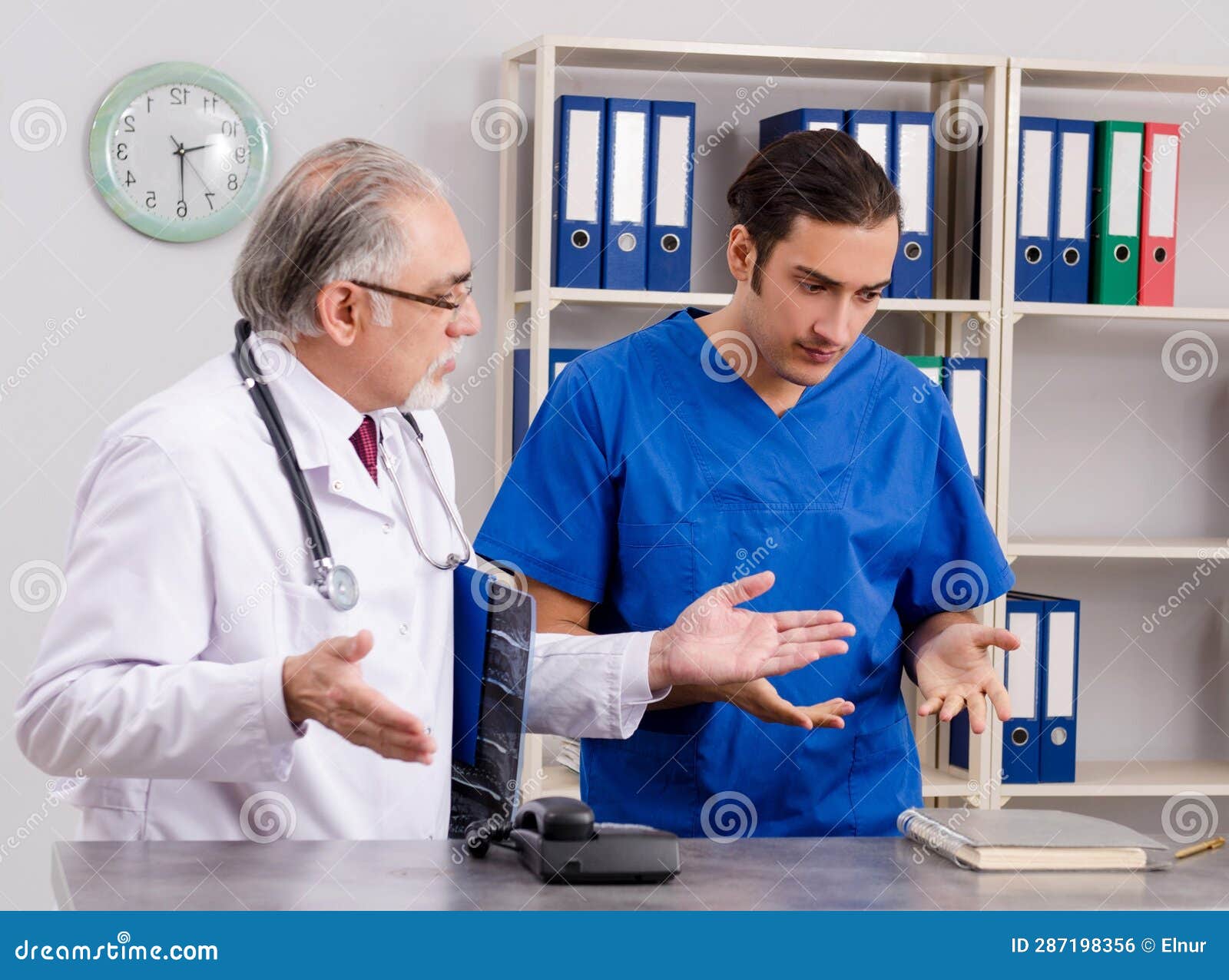 Two Doctors Talking at the Reception in Hospital Stock Photo - Image of ...