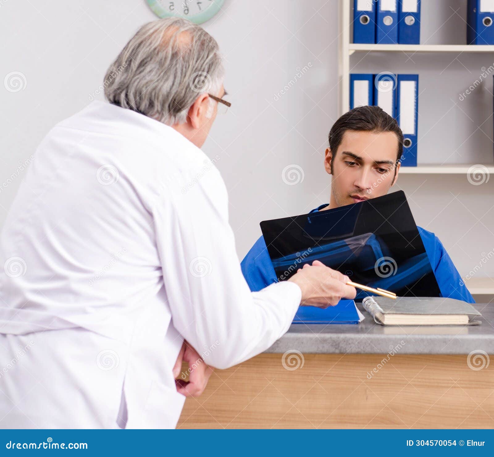 Two Doctors Talking at the Reception in Hospital Stock Photo - Image of ...