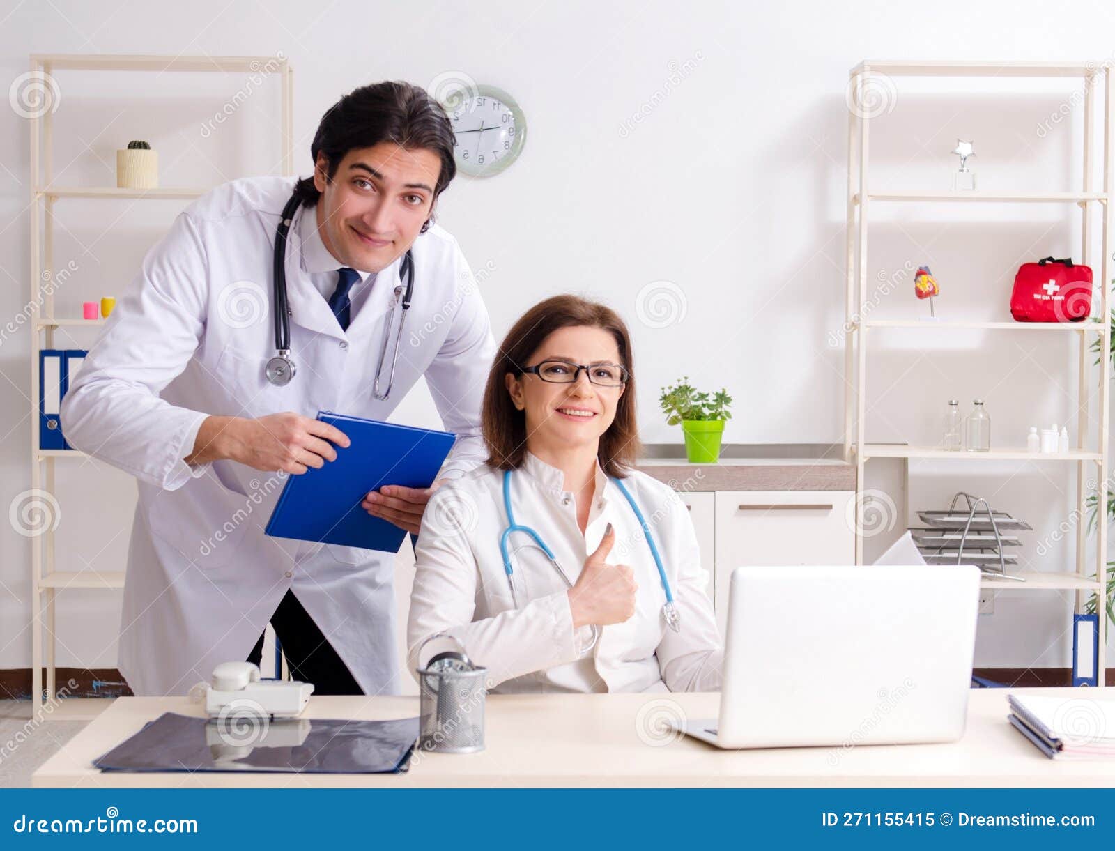 Two Doctors Working in the Clinic Stock Image - Image of discussing ...
