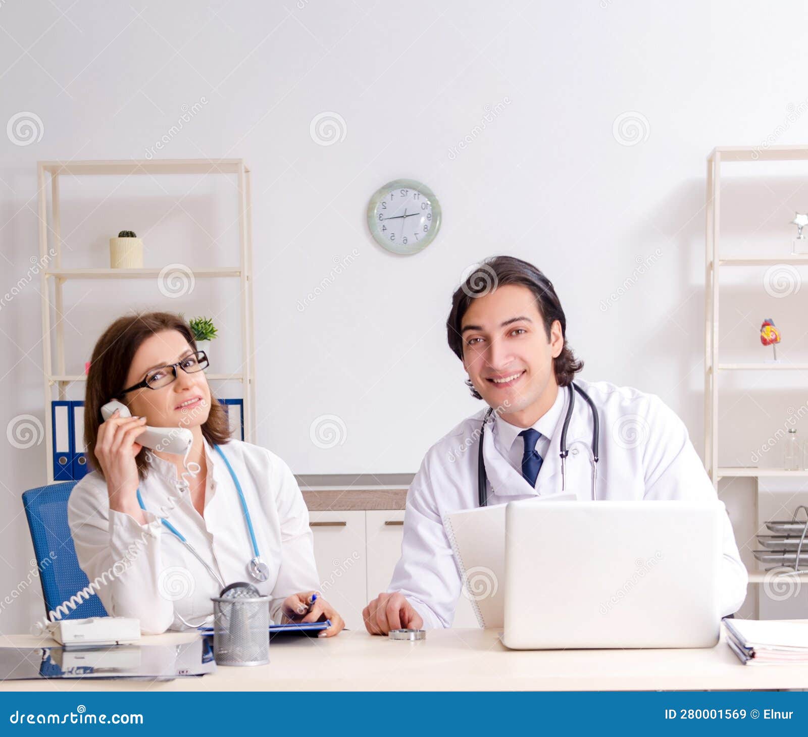 Two Doctors Working in the Clinic Stock Image - Image of profession ...