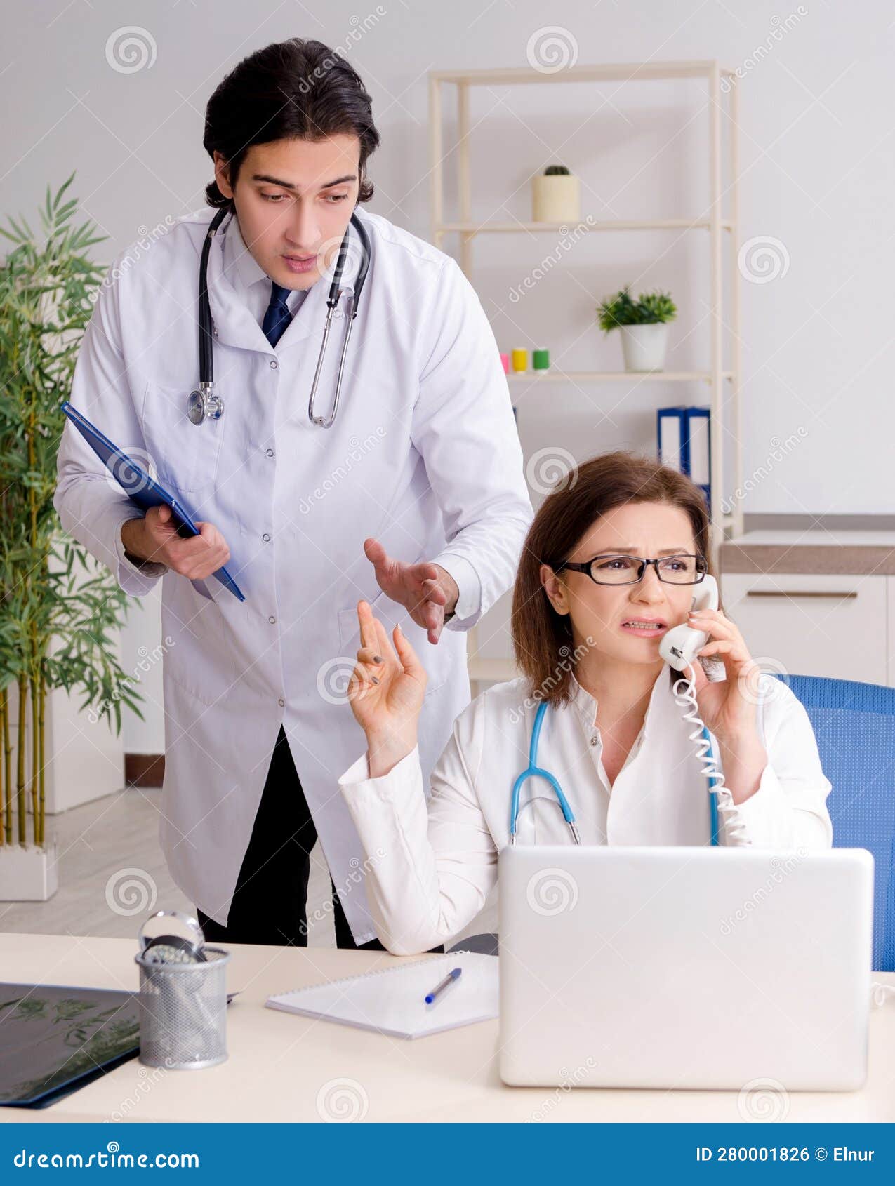 Two Doctors Working in the Clinic Stock Photo - Image of doctor ...