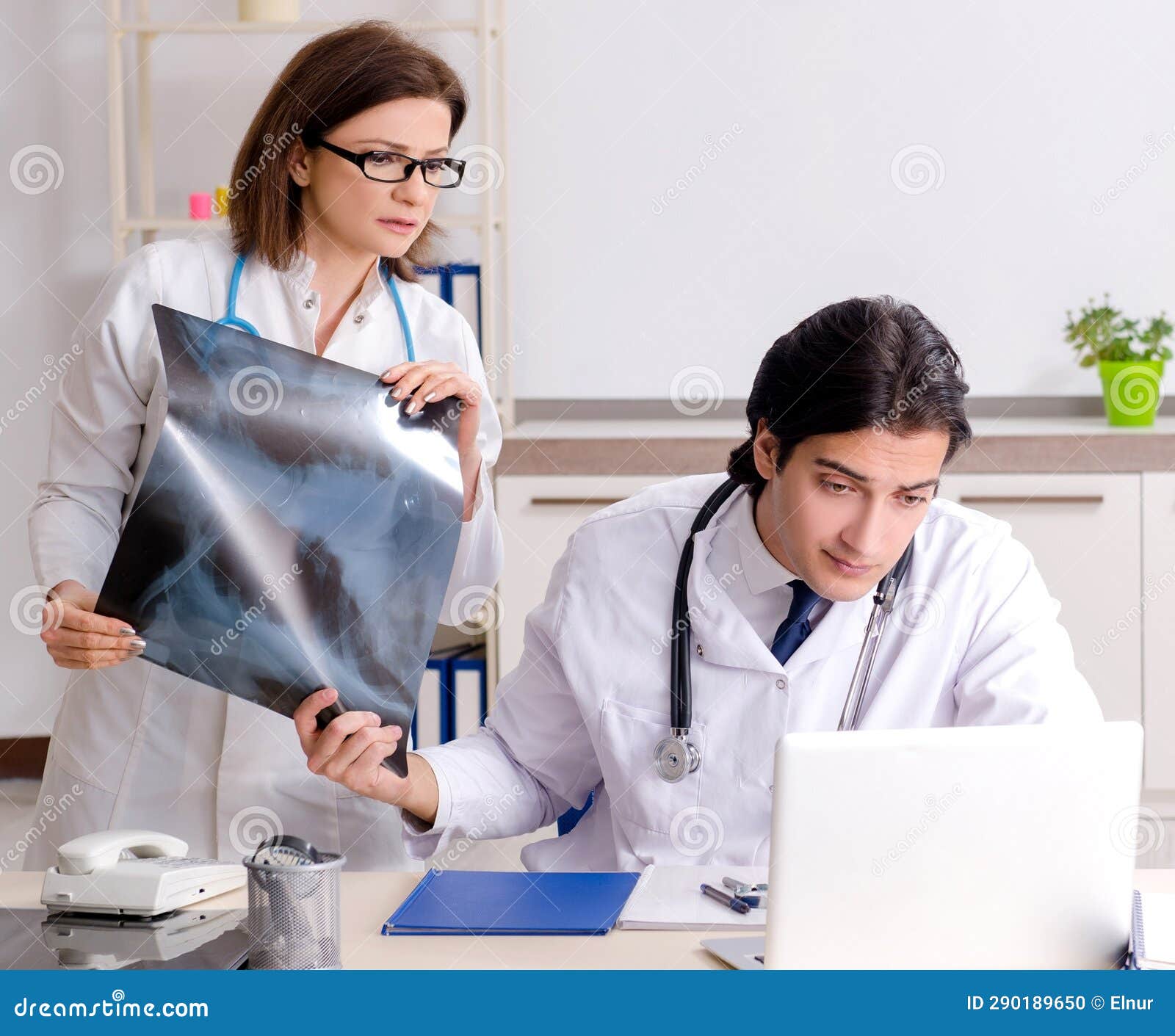 Two Doctors Working in the Clinic Stock Photo - Image of practitioner ...