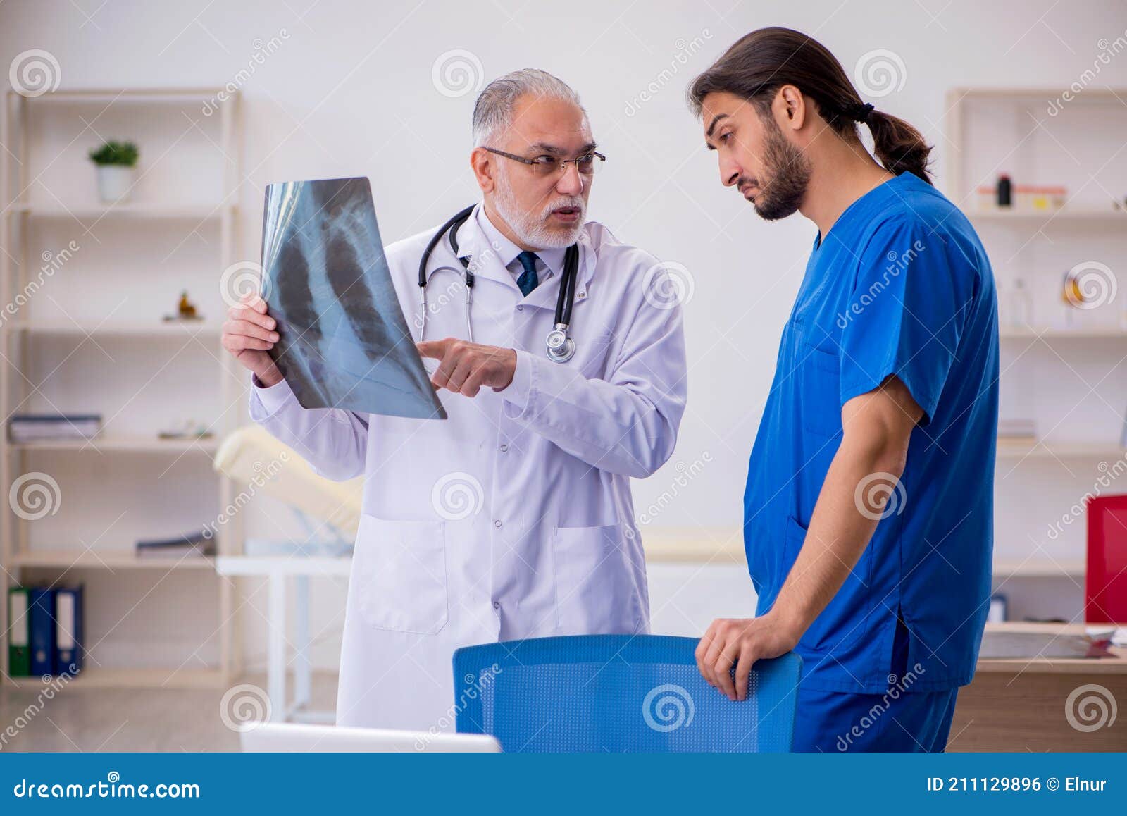 Two Doctors Working in the Clinic Stock Photo - Image of imaging ...