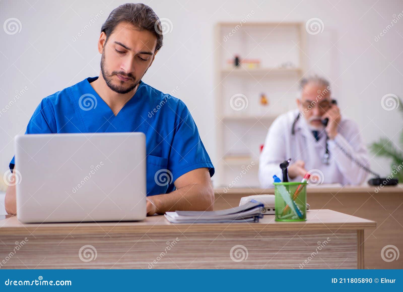 Two Doctors Working in the Clinic Stock Photo - Image of healthcare ...