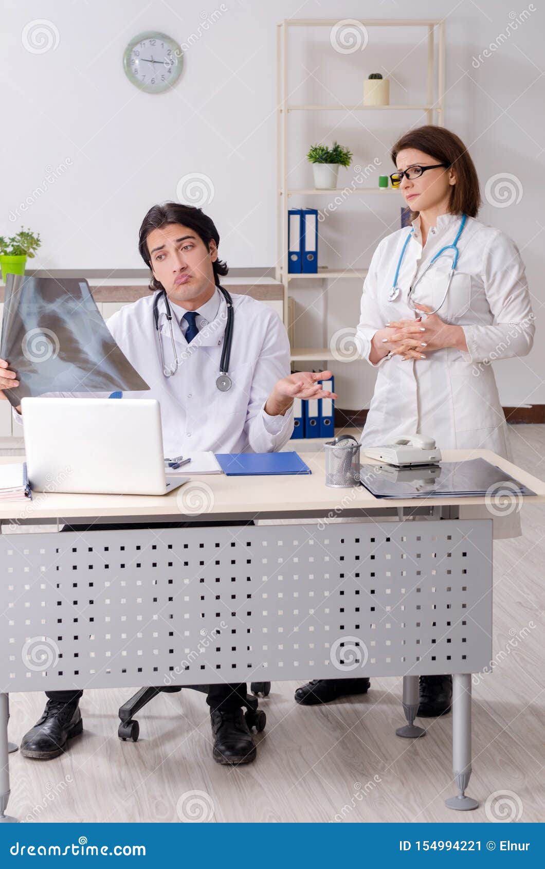 Two Doctors Working in the Clinic Stock Image - Image of colleague ...