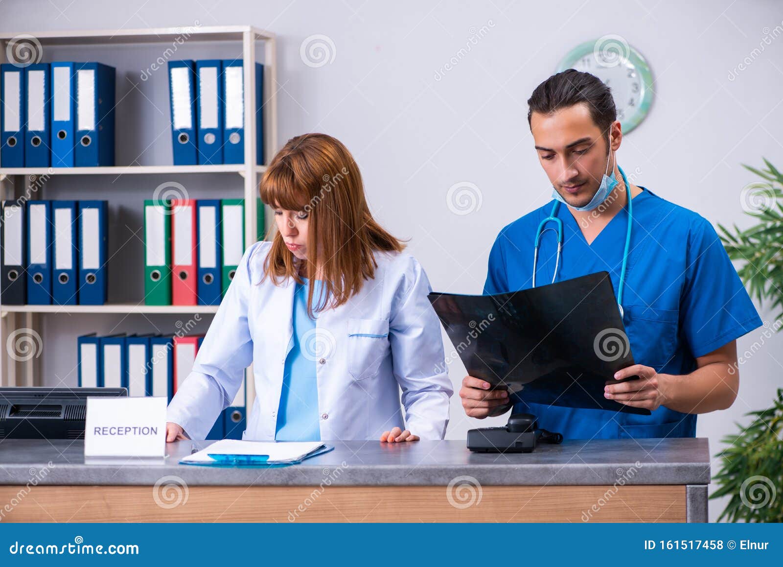 Two Doctors Working at the Reception in the Hospital Stock Photo ...