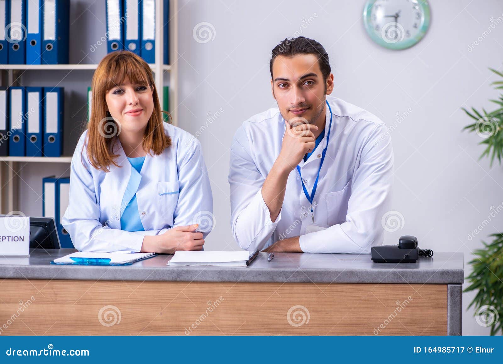 Two Doctors Working at the Reception in the Hospital Stock Image ...