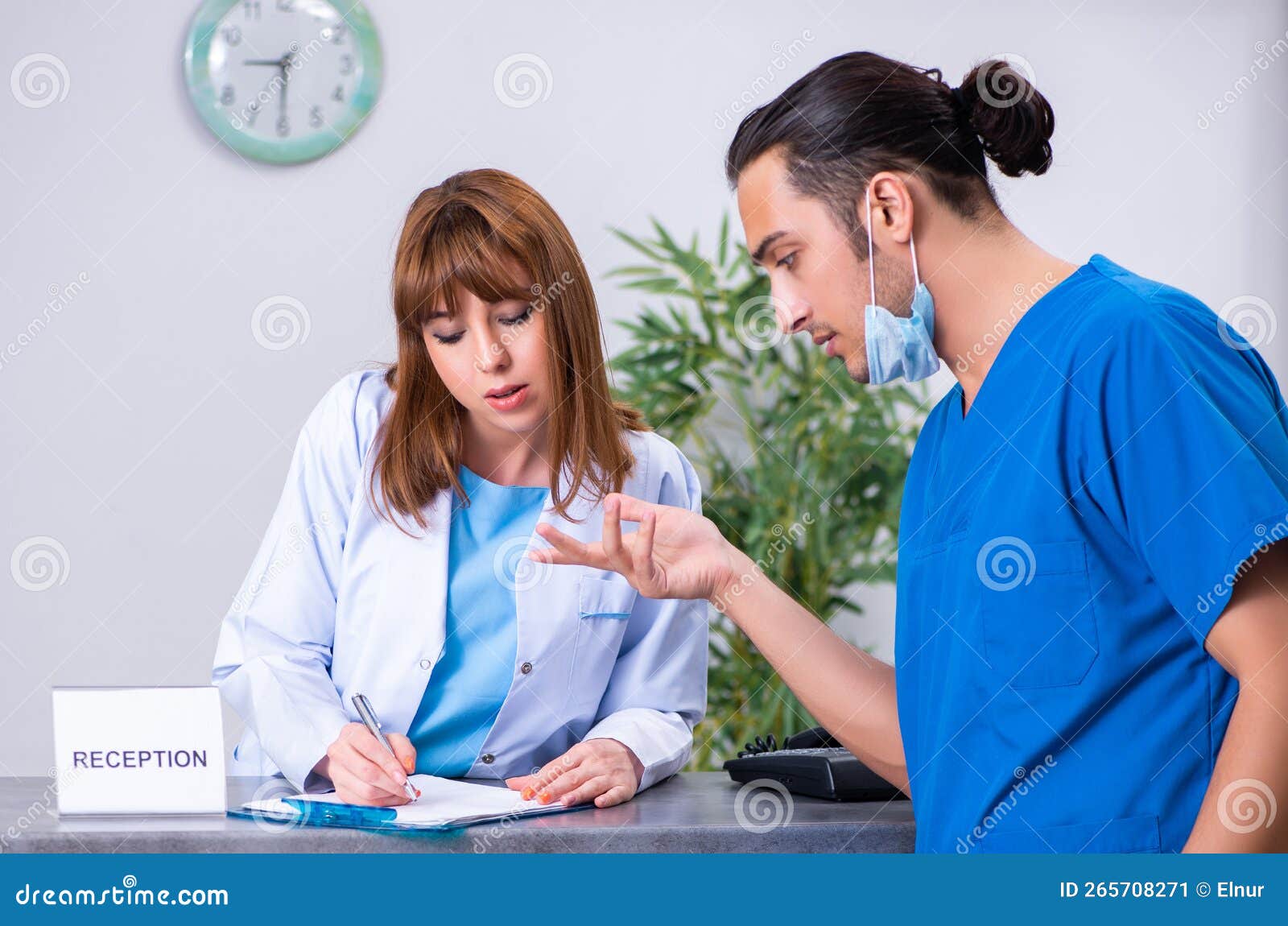 Two Doctors Working at the Reception in the Hospital Stock Image ...