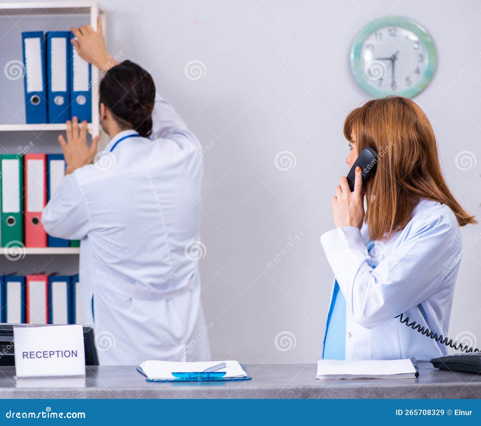 Two Doctors Working at the Reception in the Hospital Stock Image ...