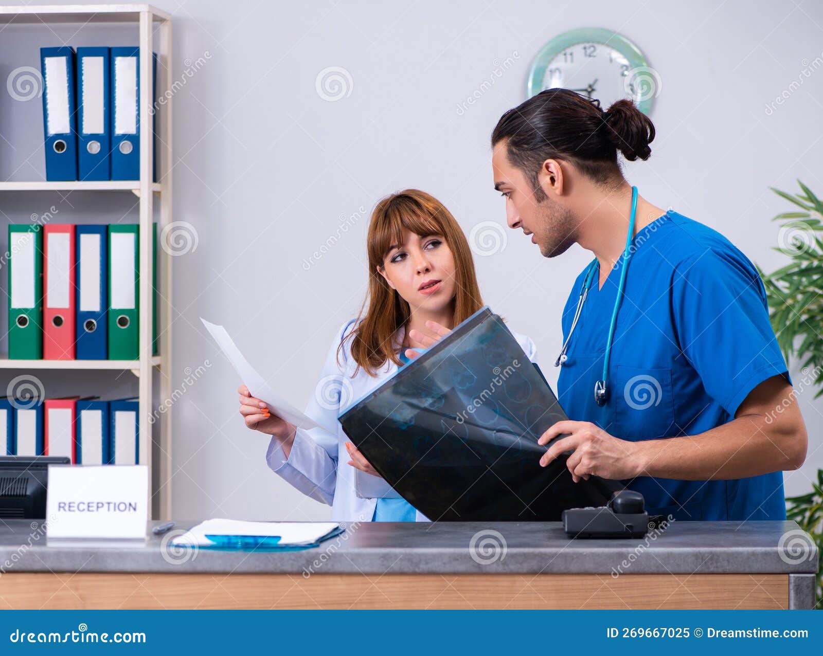 Two Doctors Working at the Reception in the Hospital Stock Image ...