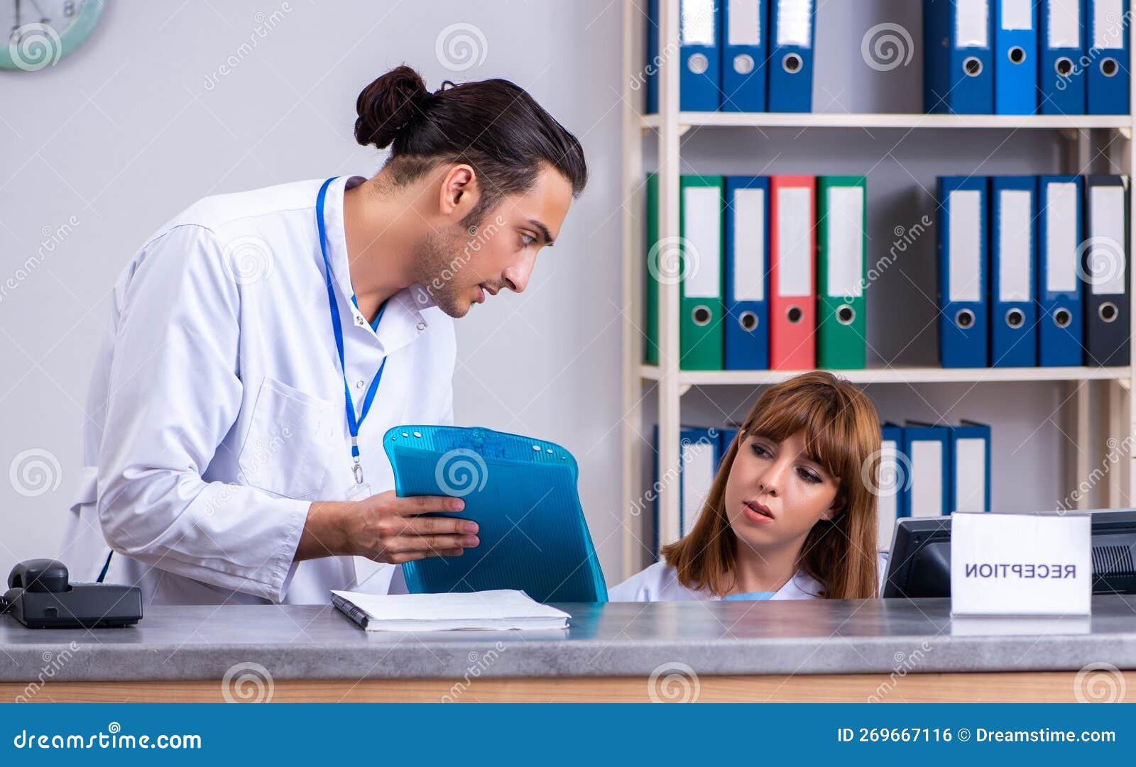 Two Doctors Working at the Reception in the Hospital Stock Photo ...