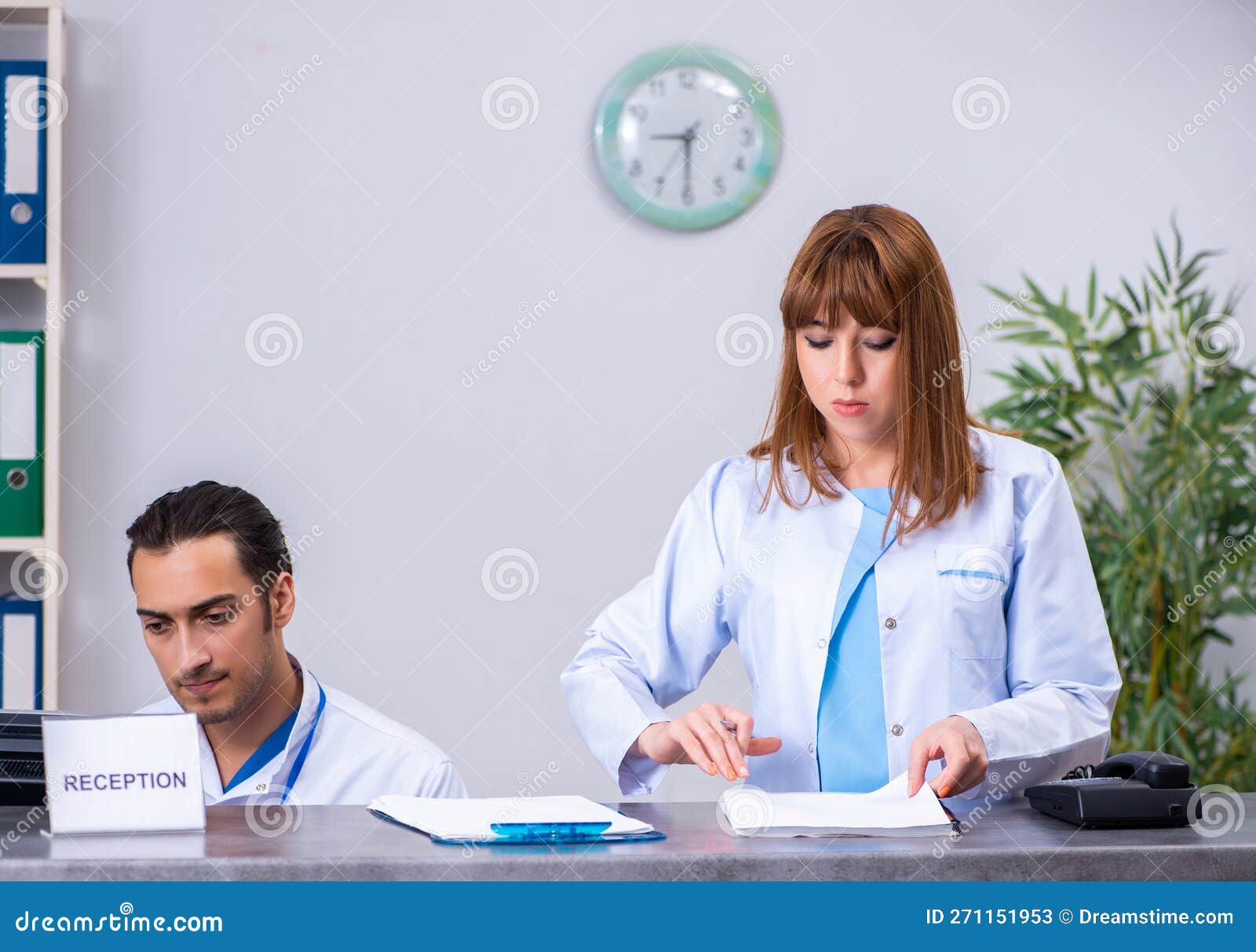 Two Doctors Working at the Reception in the Hospital Stock Image ...