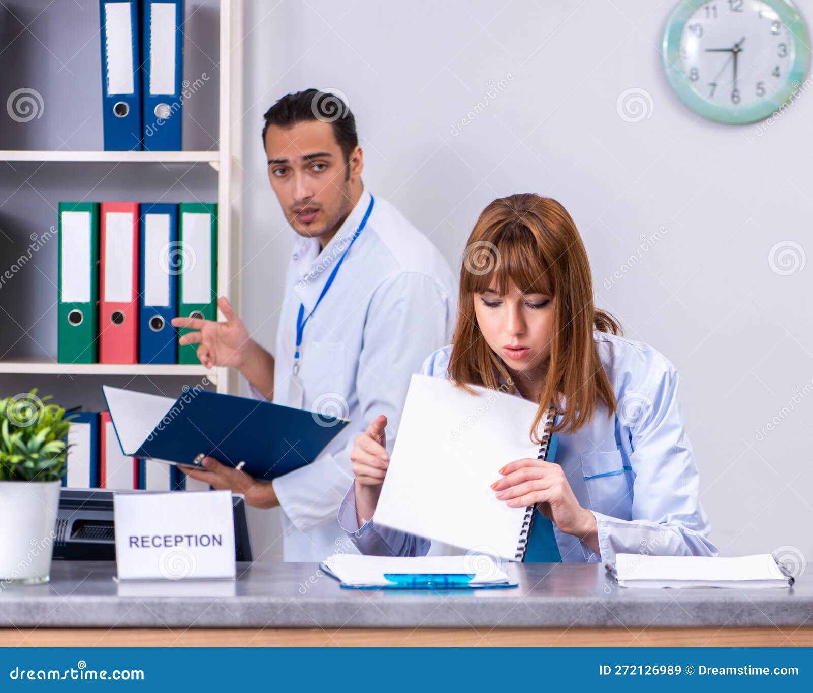 Two Doctors Working at the Reception in the Hospital Stock Image ...
